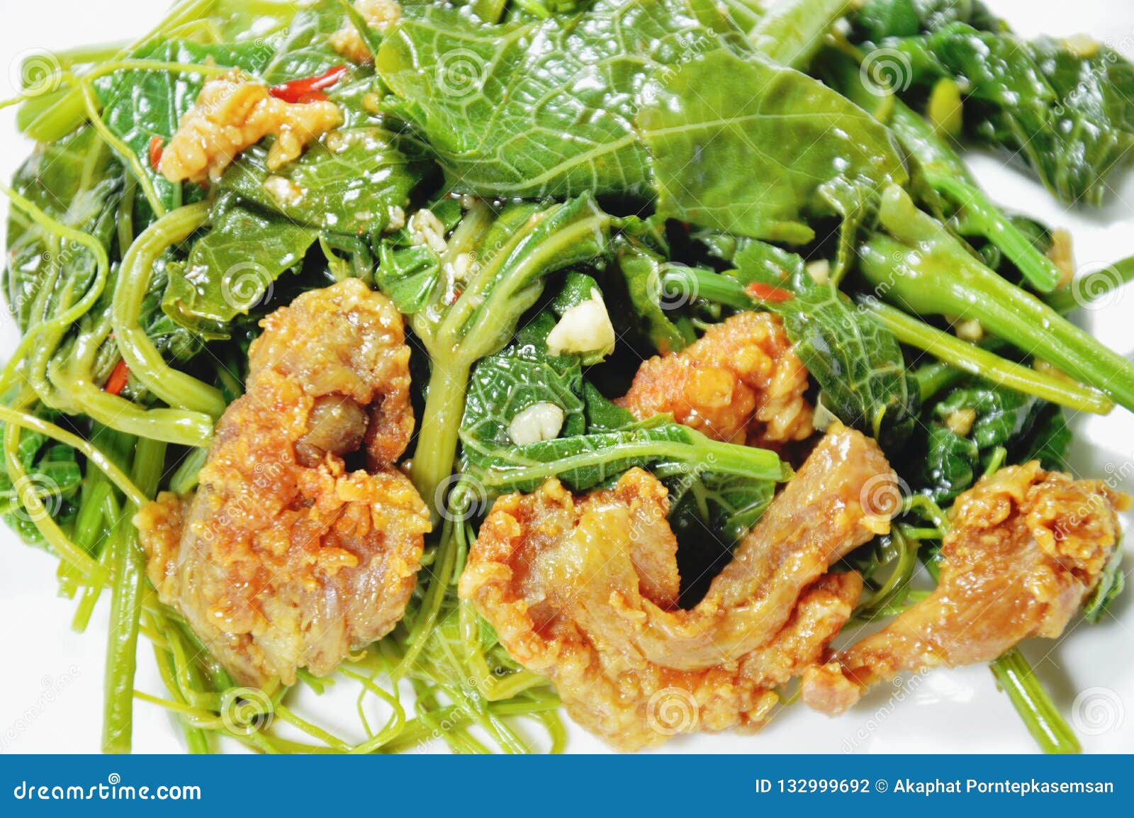 Fried Chayote Sprout with Crispy Chicken on Plate Stock Photo - Image ...