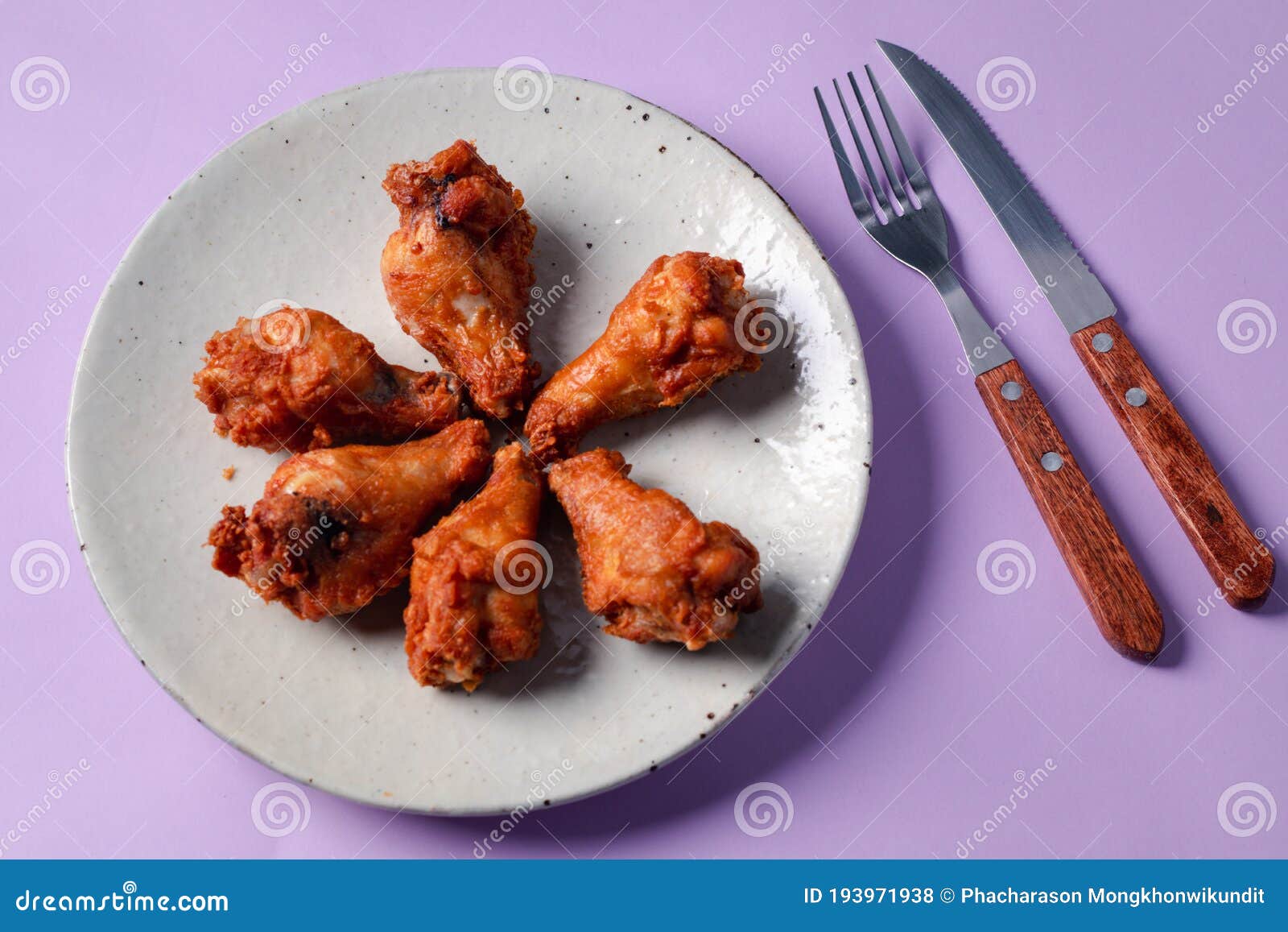 Fried Chicken in Ceramic Plates with Cutlery on the Side Stock Photo ...