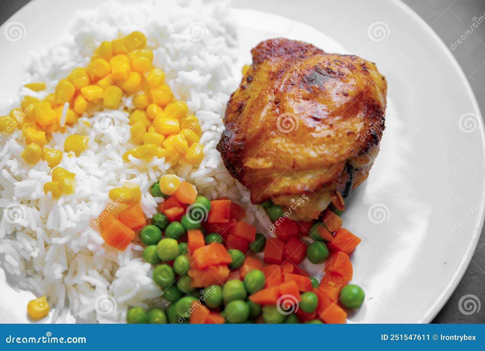 Fried Chicken Leg with Rice, Corn, Carrots and Peas Stock Image - Image ...