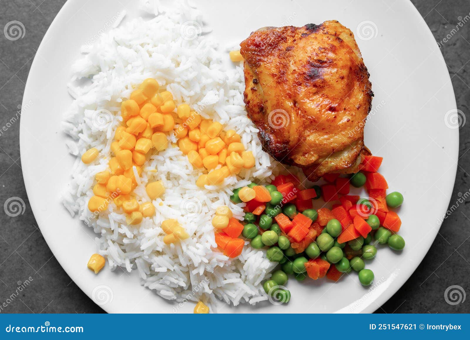Fried Chicken Leg with Rice, Corn, Carrots and Peas Stock Image - Image ...