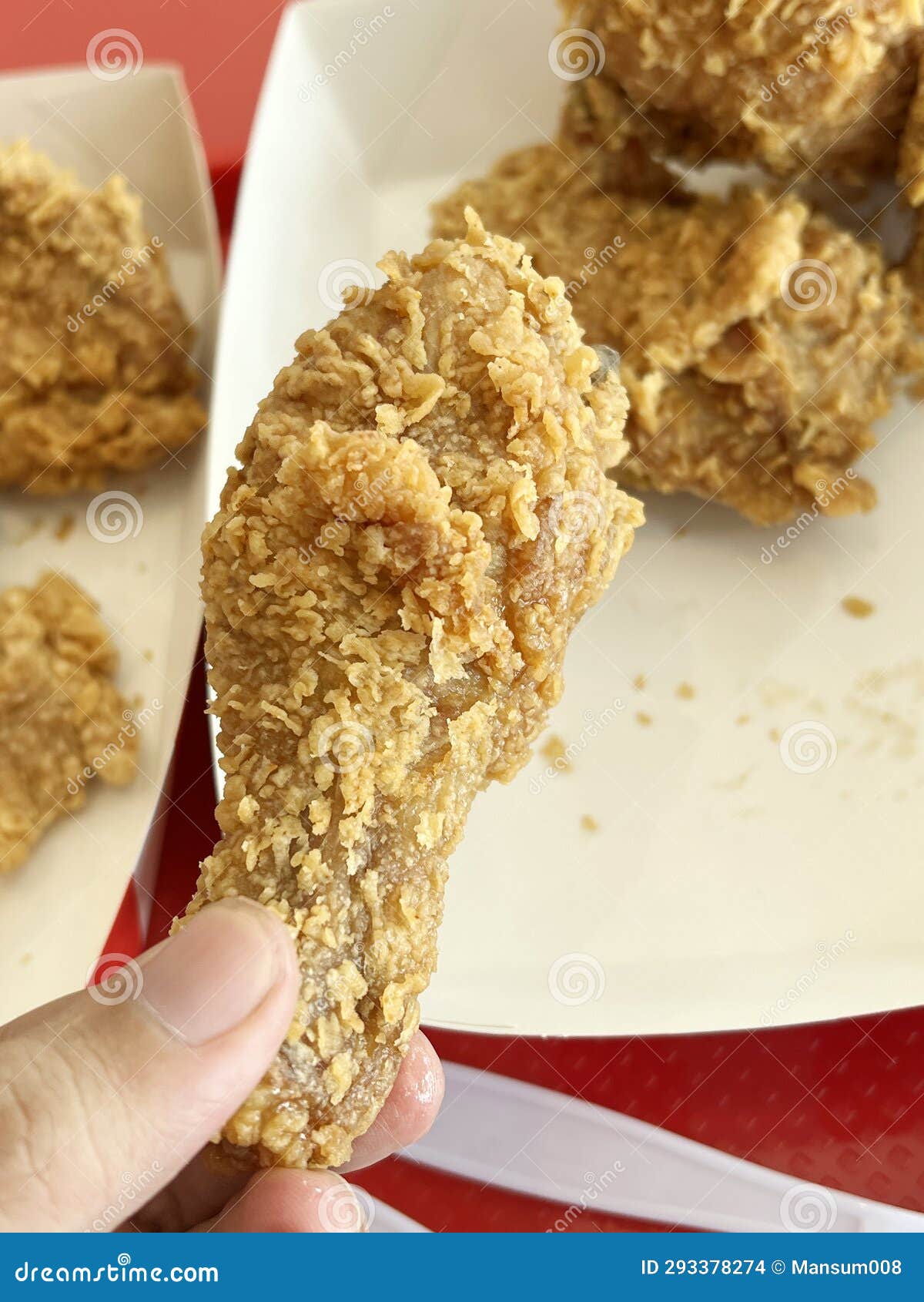 Fried chicken on man hand stock photo. Image of cooked - 293378274