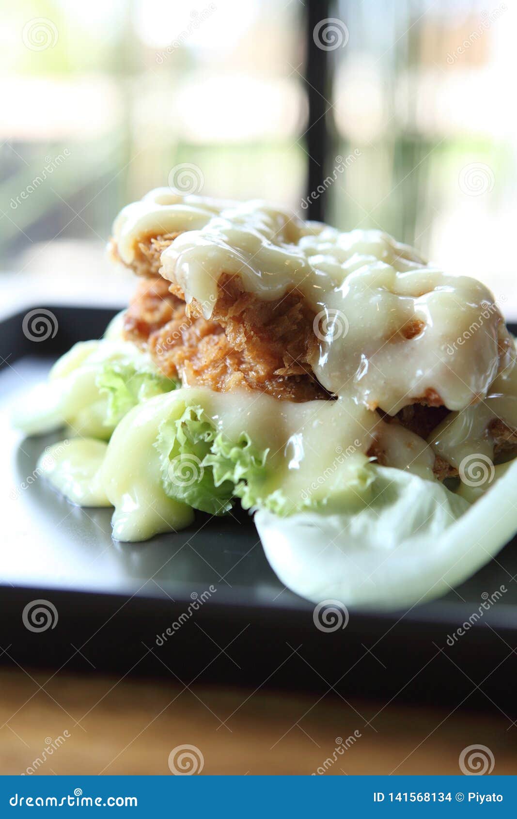 Fried chicken on a plate stock photo. Image of leaf - 141568134