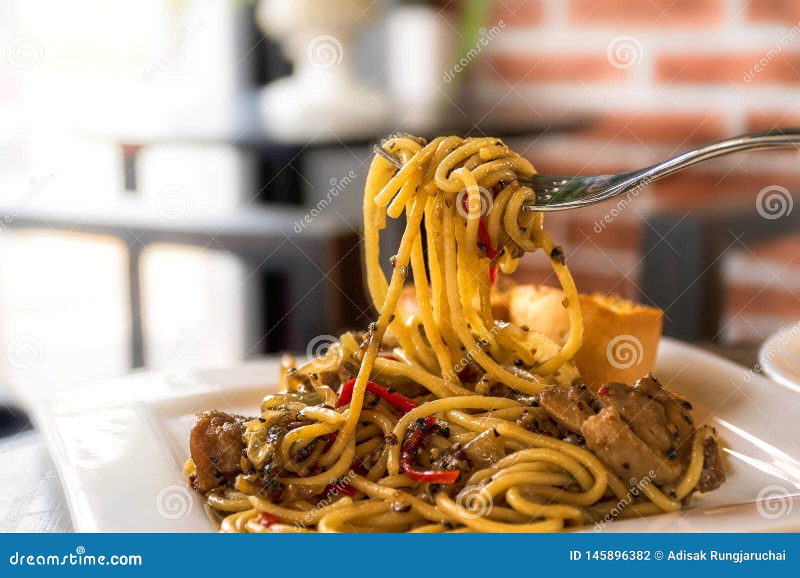 Fried Chicken Spaghetti with Black Pepper on White Plate with Fork and ...