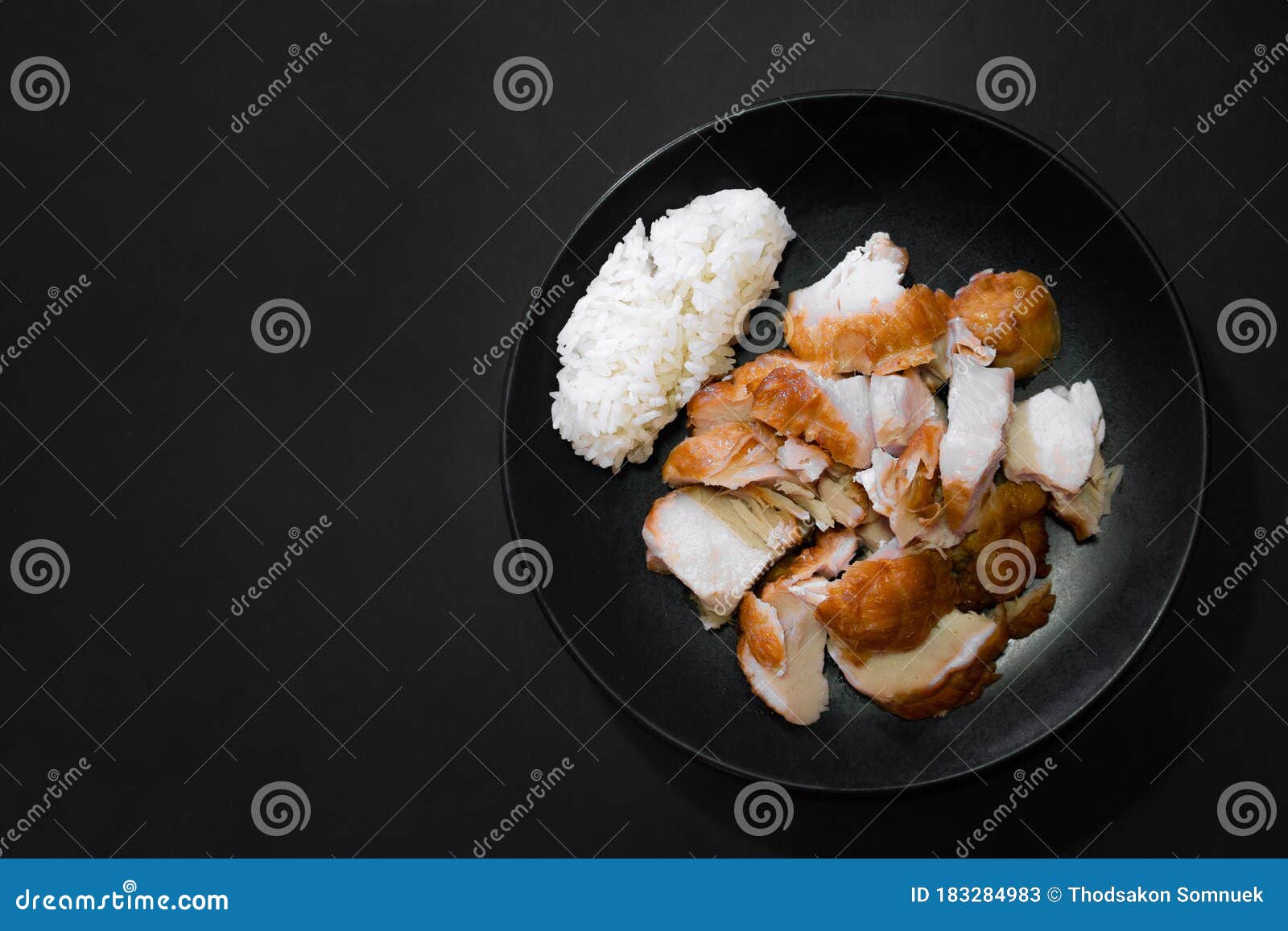 Fried Chicken with Sticky Rice on Dish on a Black Background Stock ...
