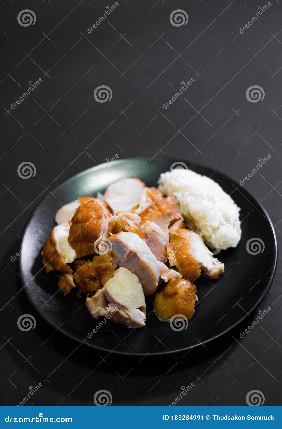 Fried Chicken with Sticky Rice on Dish on a Black Background Stock ...
