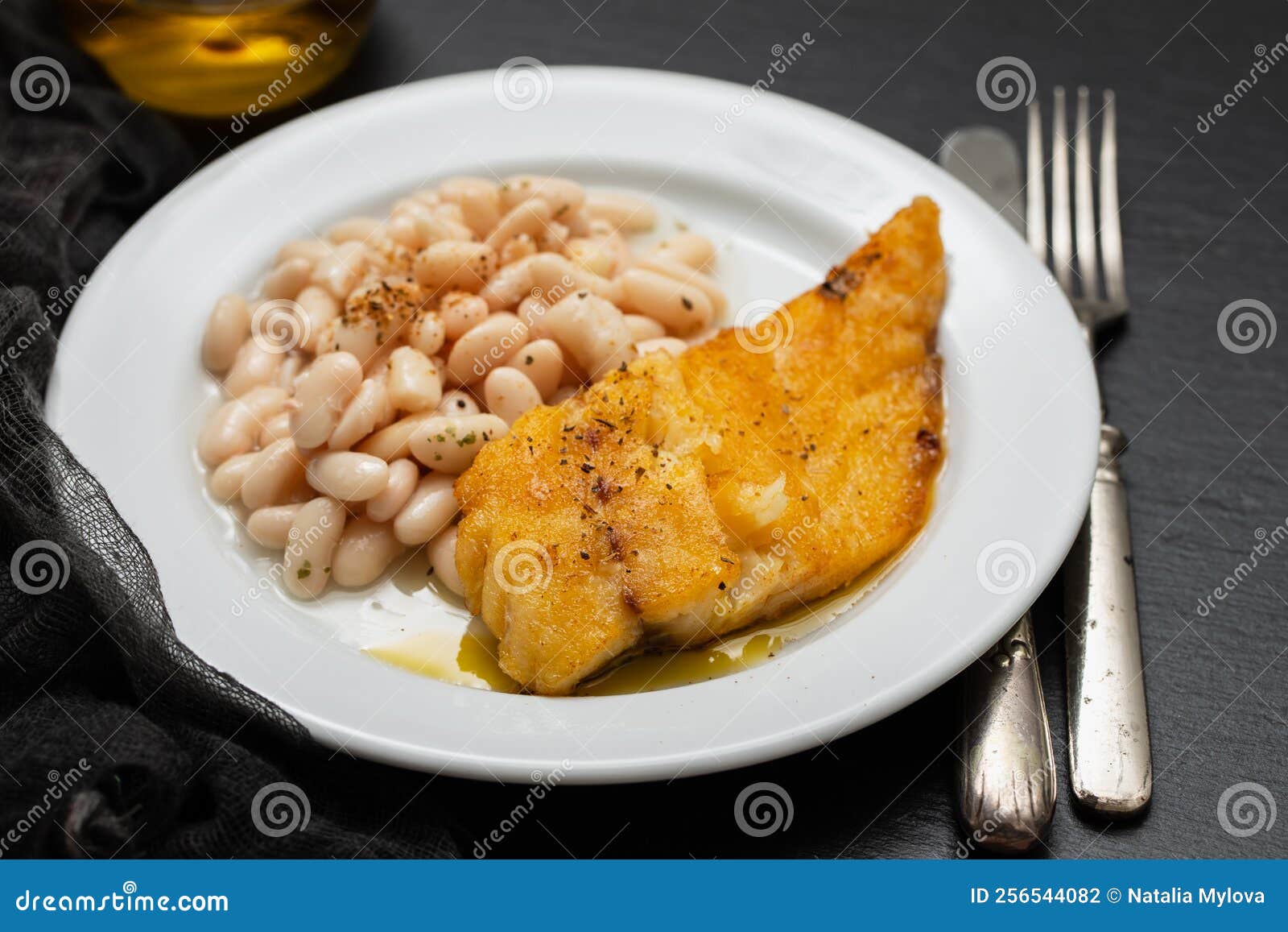 Fried Cod Fish with White Beans on the Plate. Stock Photo - Image of ...