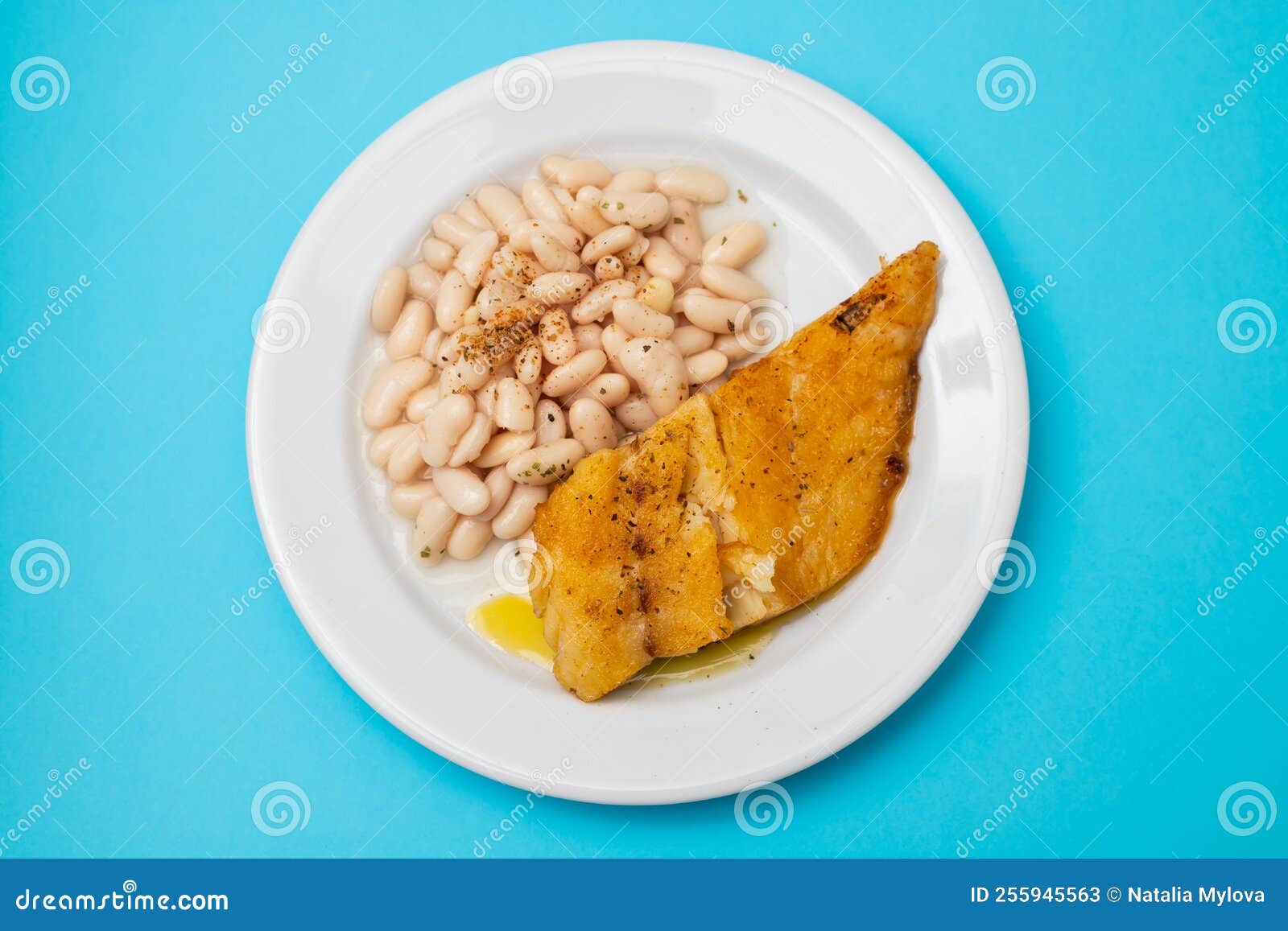 Fried Cod Fish with White Beans on the Plate Stock Image - Image of ...