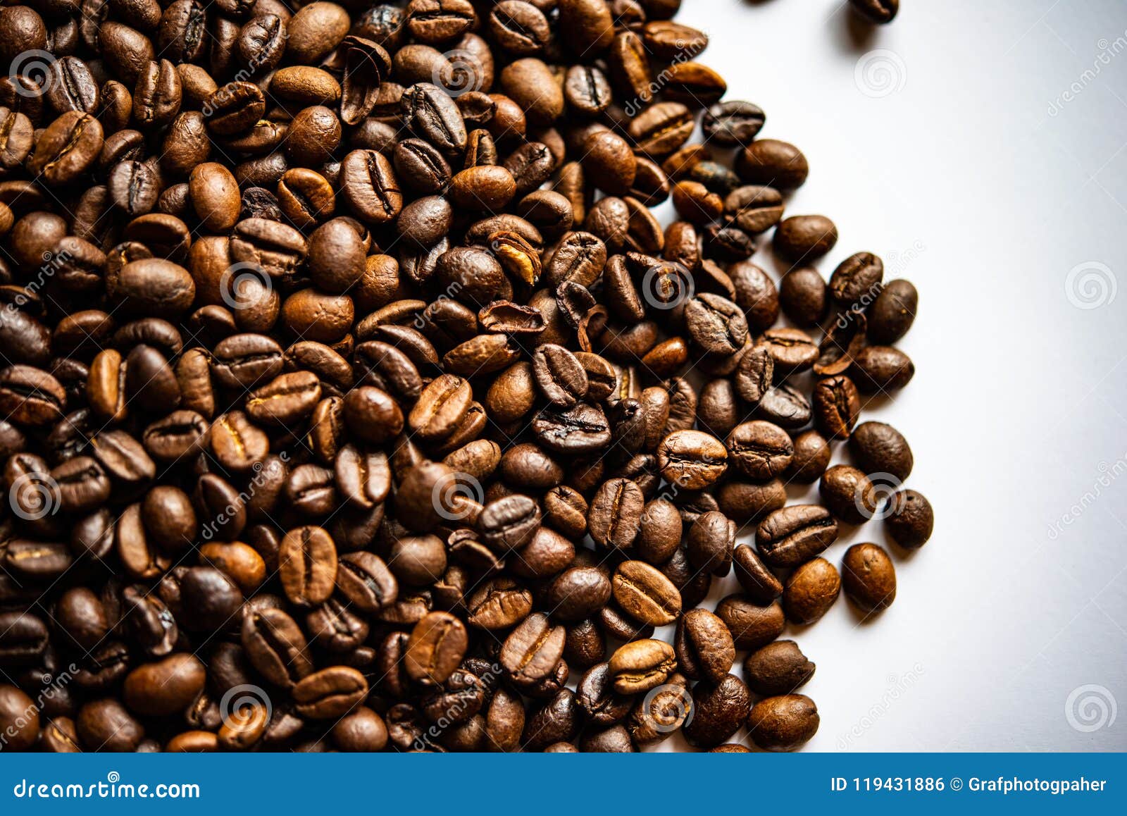 Fried Coffee Grains Lie on a Light Surface on the Table. Stock Photo ...