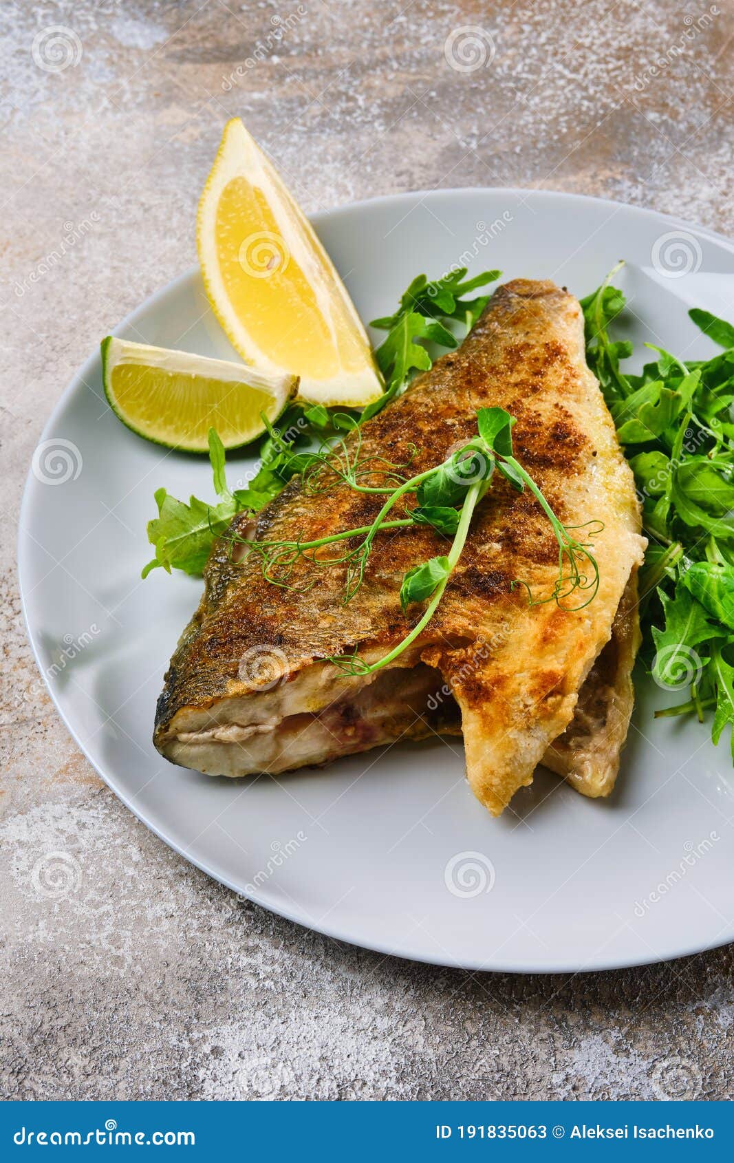 Fried Dorada Fish with Fresh Arugula Stock Image - Image of dinner ...