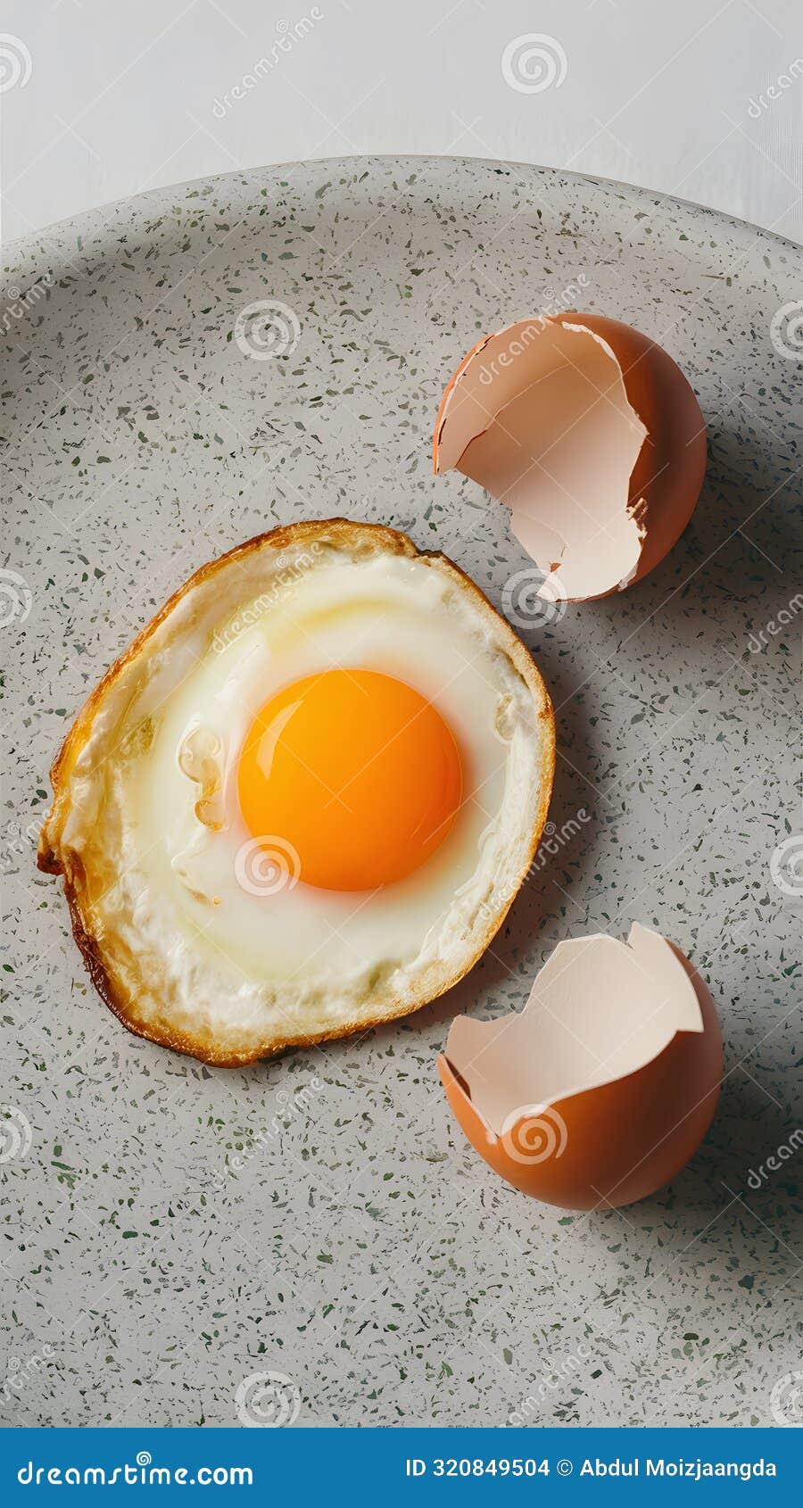 Cracked Egg With Intact Yolk On Wooden Surface Stock Photo ...