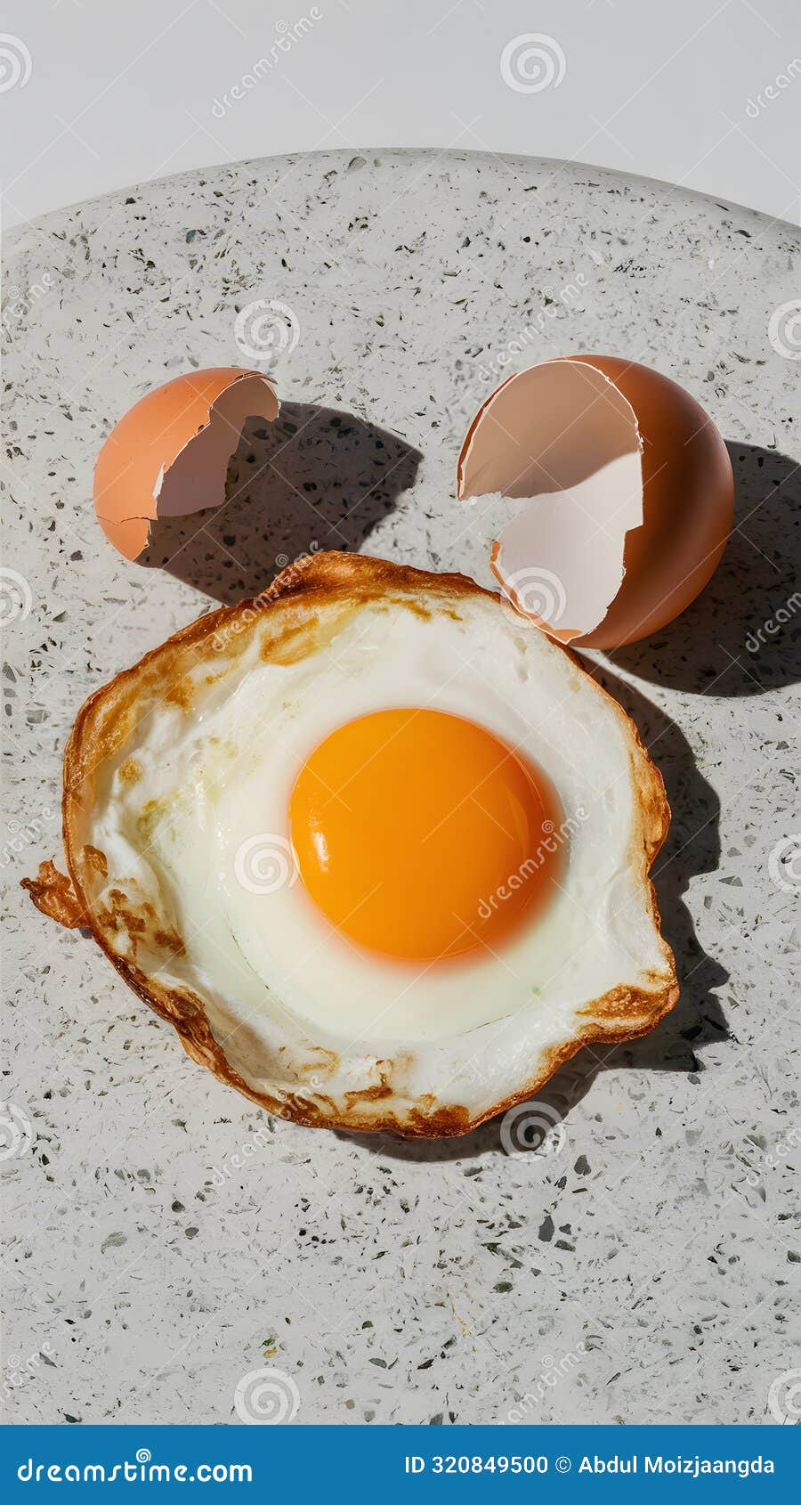 Fried Egg on Speckled Surface with Intact Yolk, Broken Shell, Simple ...