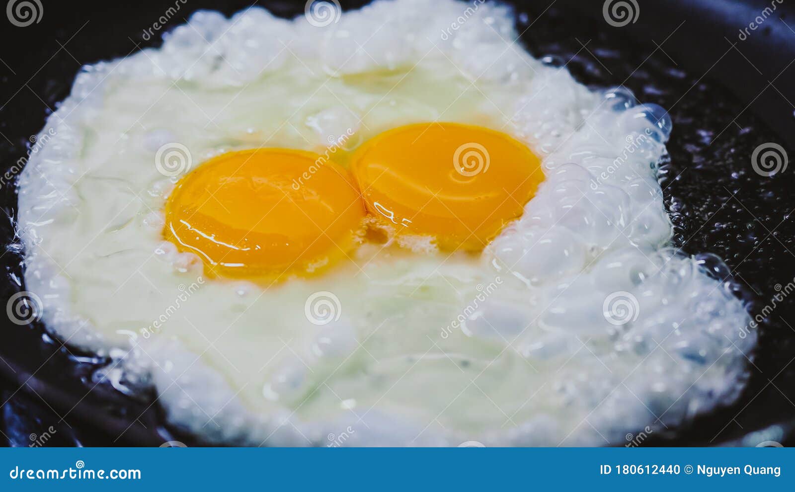 Fried egg with two yolks stock photo. Image of food - 180612440
