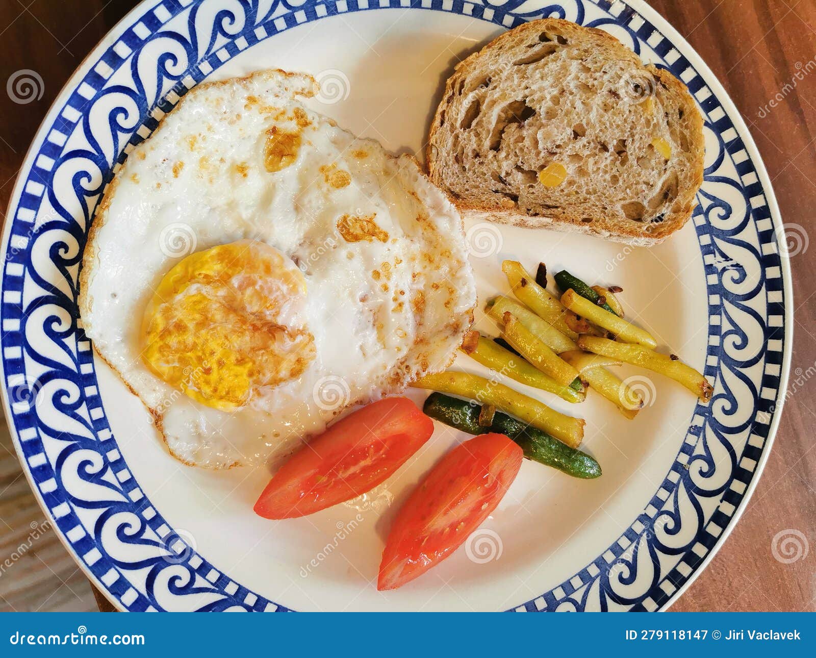 Fried egg with vegetable stock image. Image of tomato - 279118147