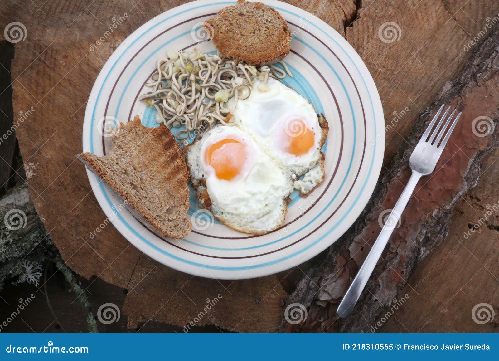 Fried Eggs Dish with Toast and Elvers Stock Image - Image of seafood ...