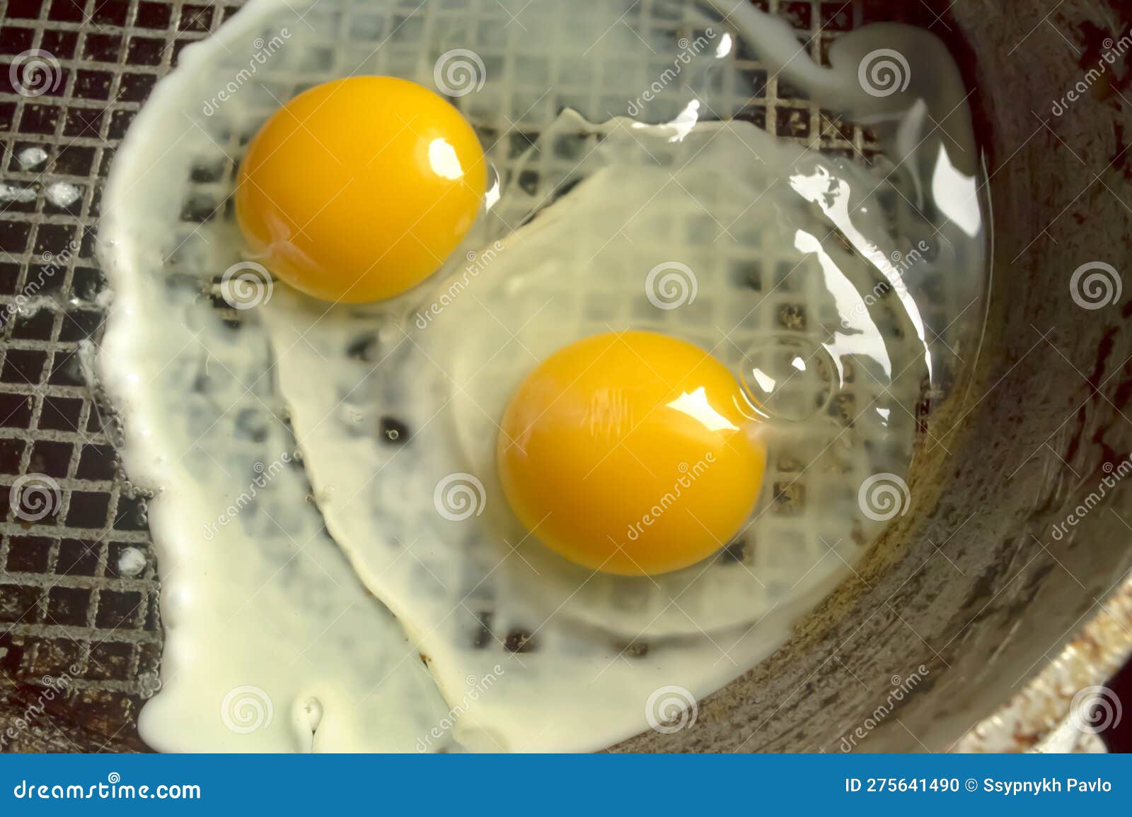 Fried Eggs. Raw Eggs in a Pan. Eggs with Yellow Yolk are Fried in a Pan ...