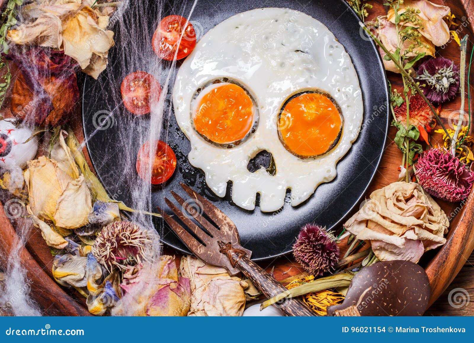 Fried Eggs in the Shape of a Skull and Fresh Tomatoes. Breakfast in ...