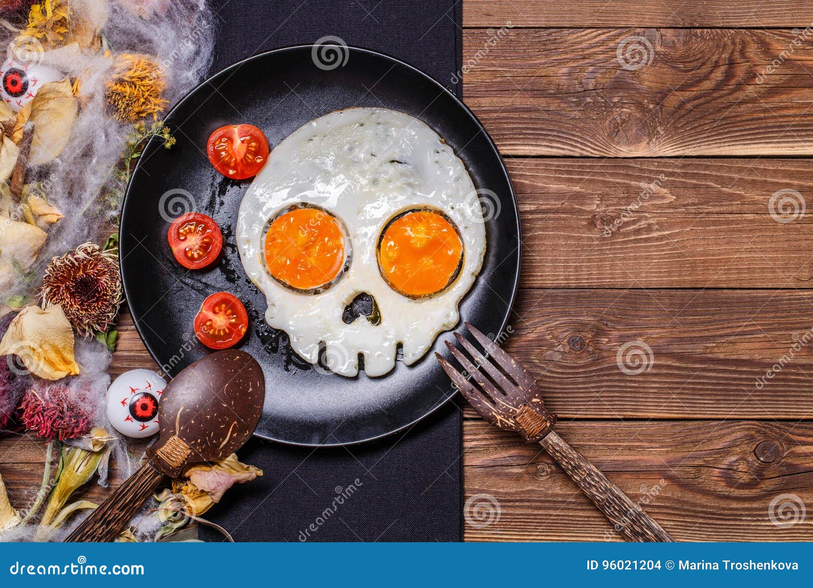 Fried Eggs in the Shape of a Skull and Fresh Tomatoes. Breakfast in ...