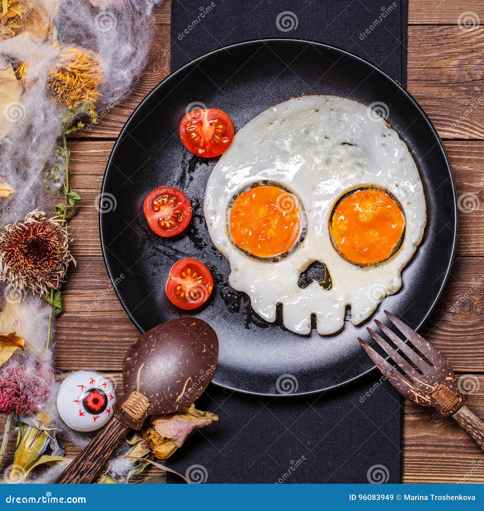 Fried Eggs in the Shape of a Skull and Fresh Tomatoes. Breakfast in ...