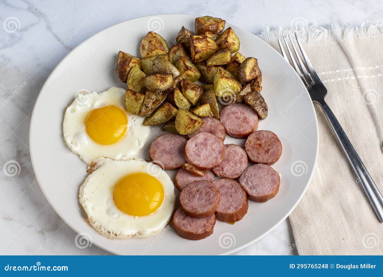 Fried Eggs with Sliced Kielbasa and Home Fries Stock Photo - Image of ...