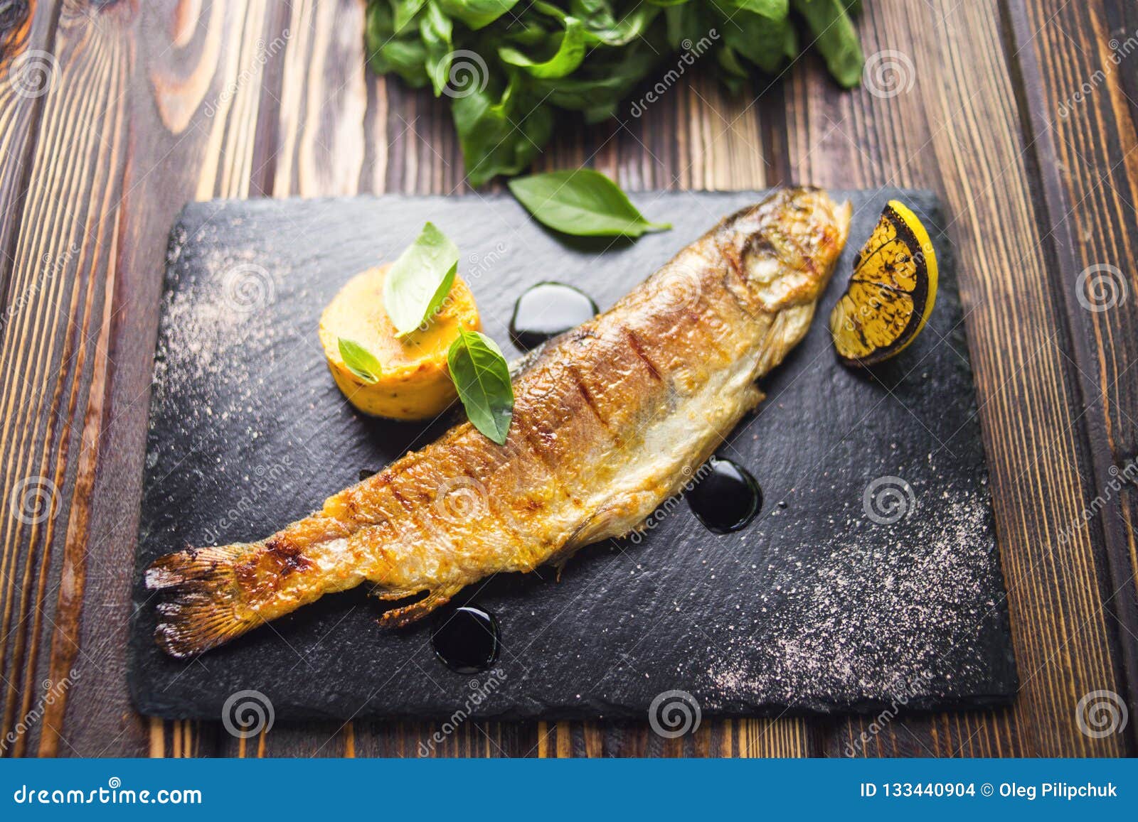 Fried fish with basil stock photo. Image of dinner, cuisine - 133440904