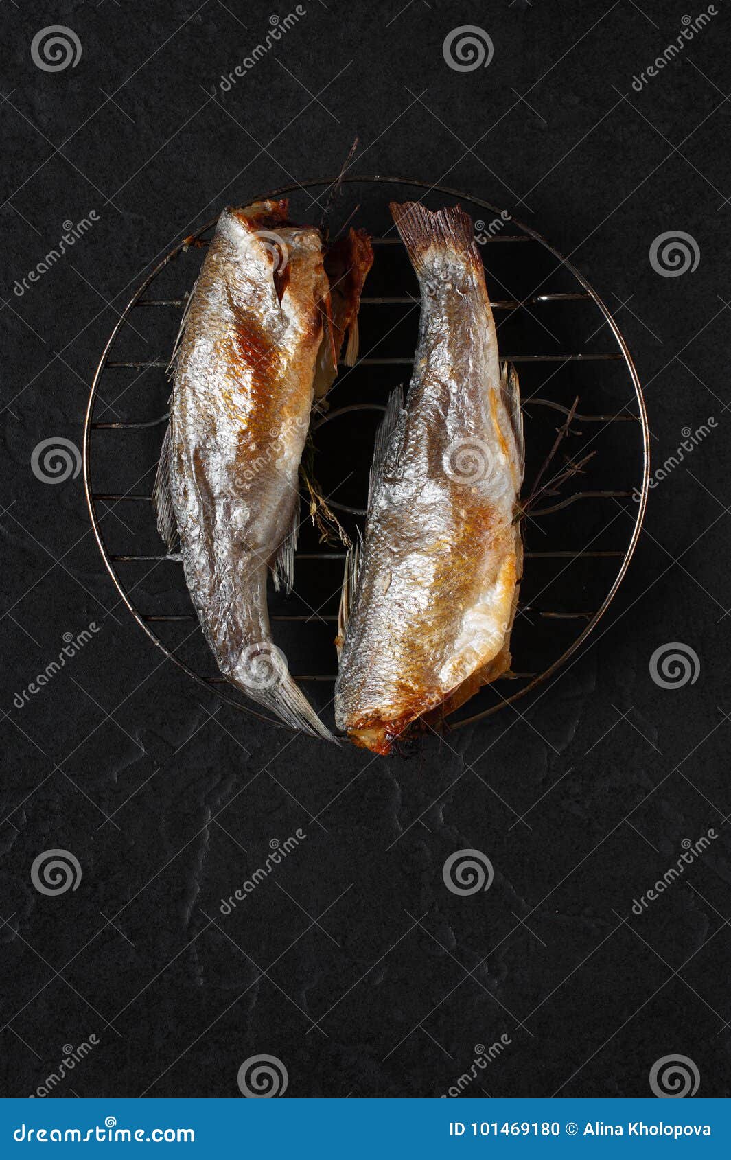Fried Fish on the Black Table Stock Photo - Image of kitchen, lubina ...