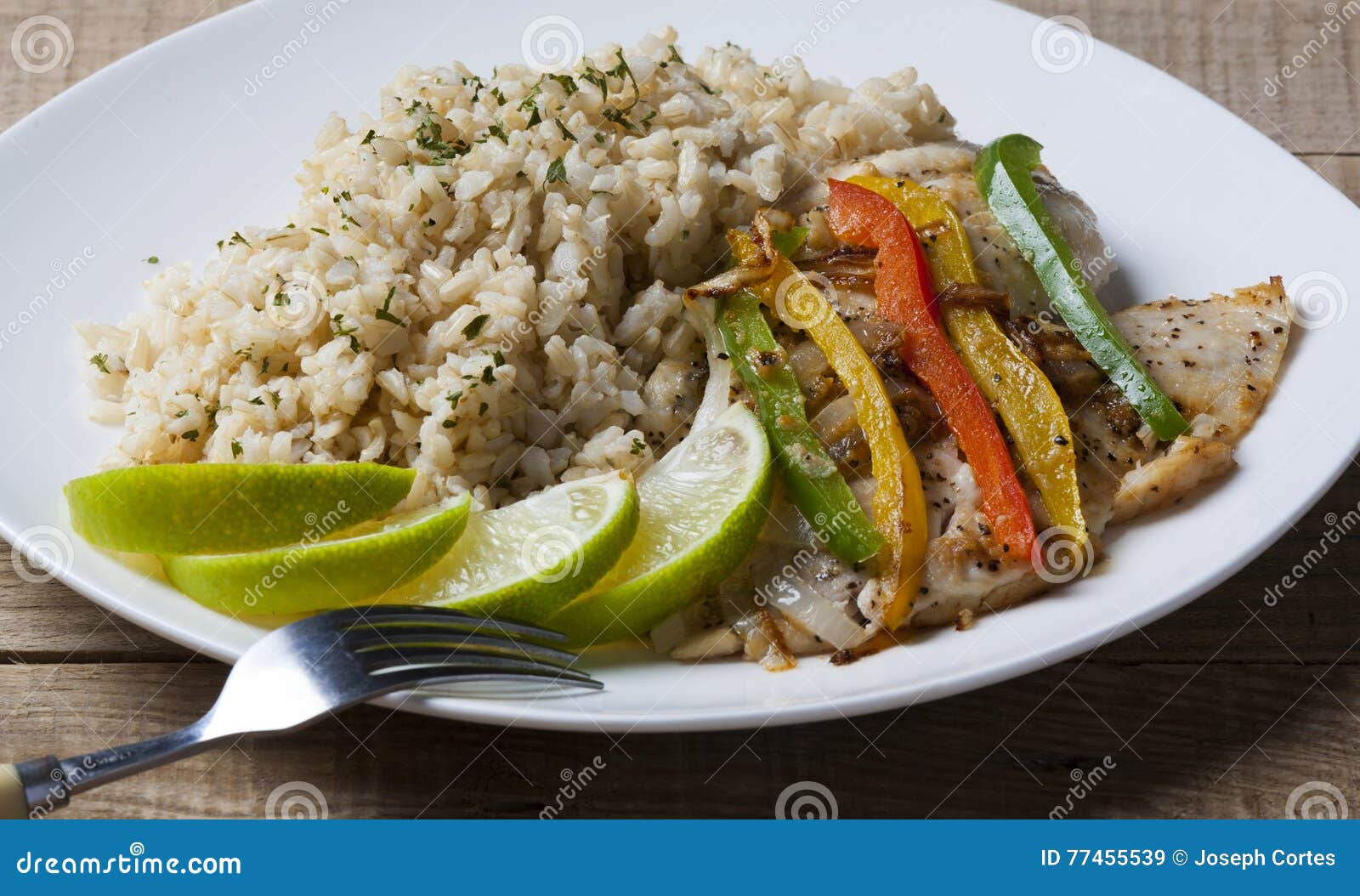 Fried fish with brown rice stock image. Image of dish - 77455539