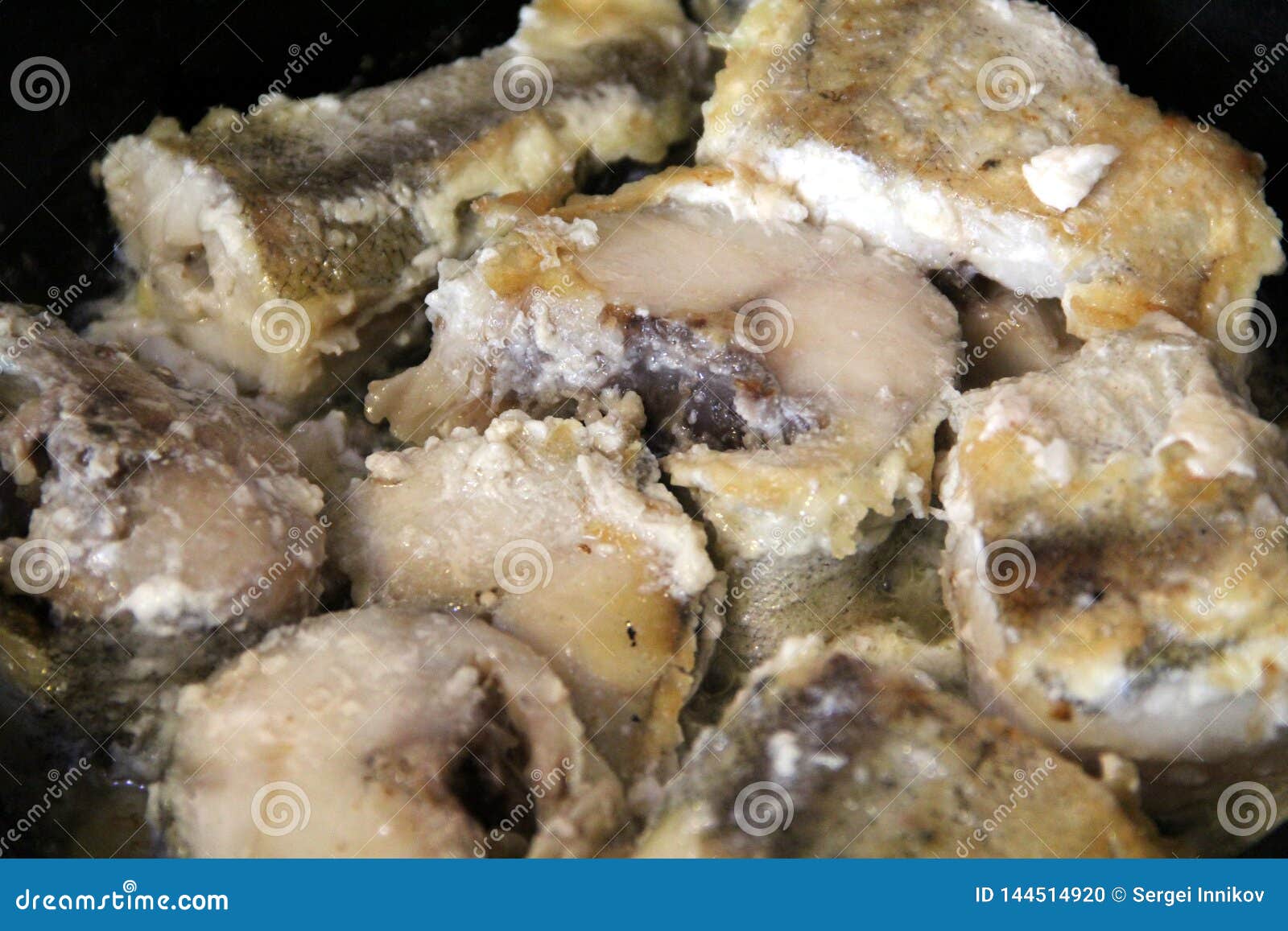 Fried fish cut into pieces stock photo. Image of salad - 144514920