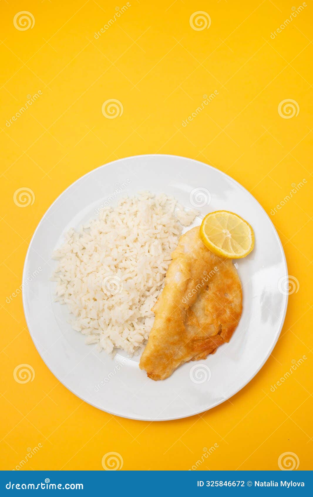 Fried Fish Fillets with Rice and Lemon on Plate Stock Photo - Image of ...