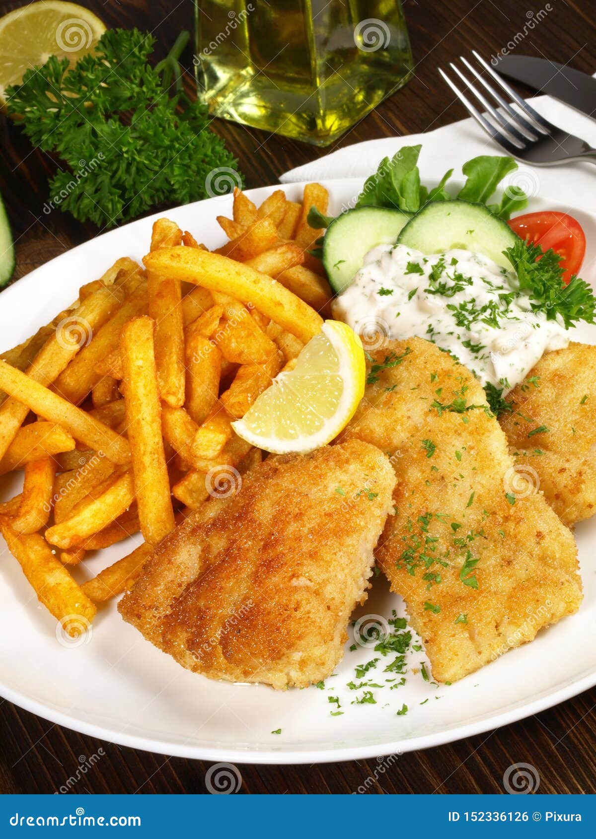 Two Fried Fish Fillet From The Flatfish Flounder With Potatoes, Spinach ...