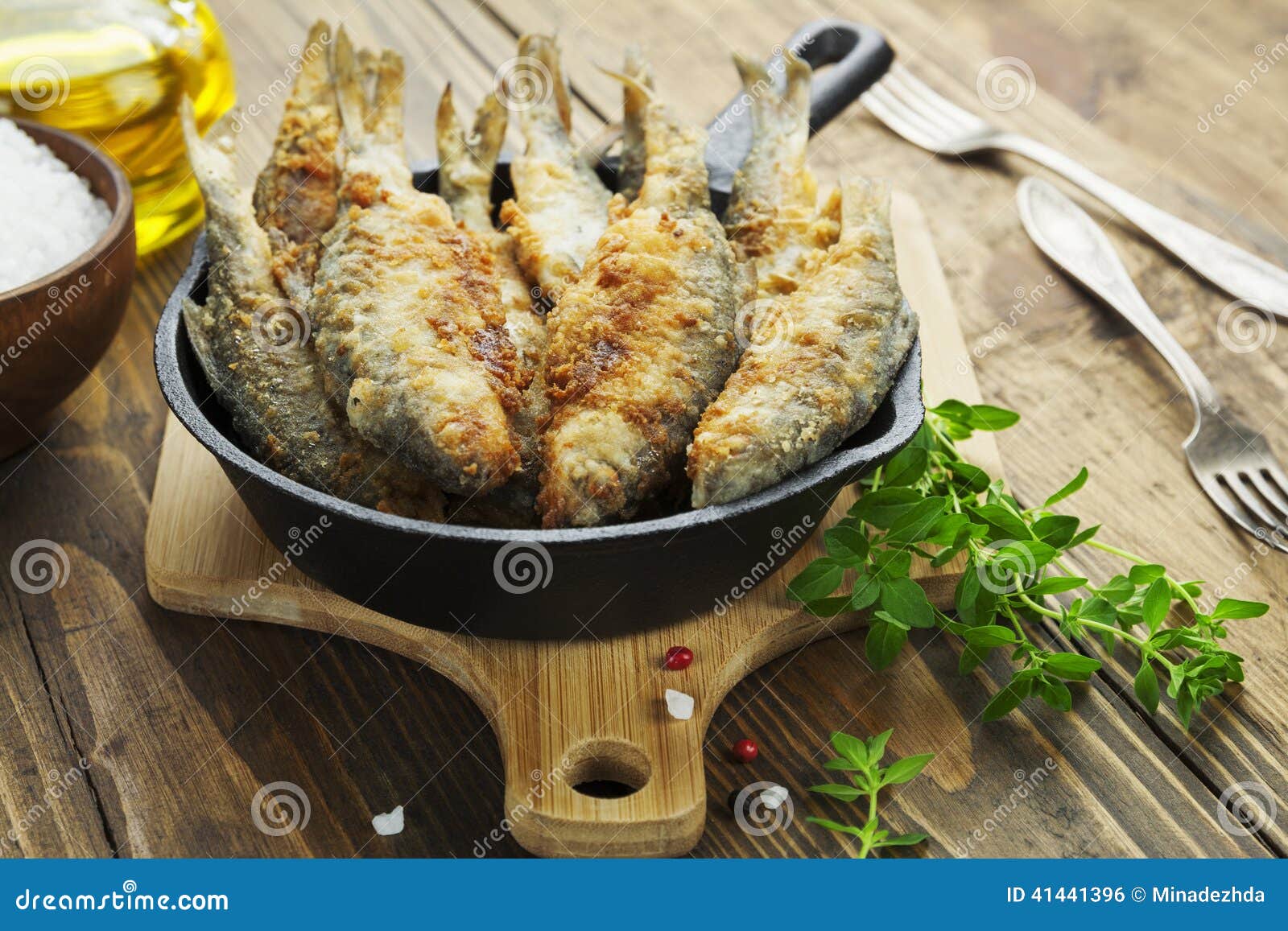 Fried fish in a frying pan stock photo. Image of meal - 41441396