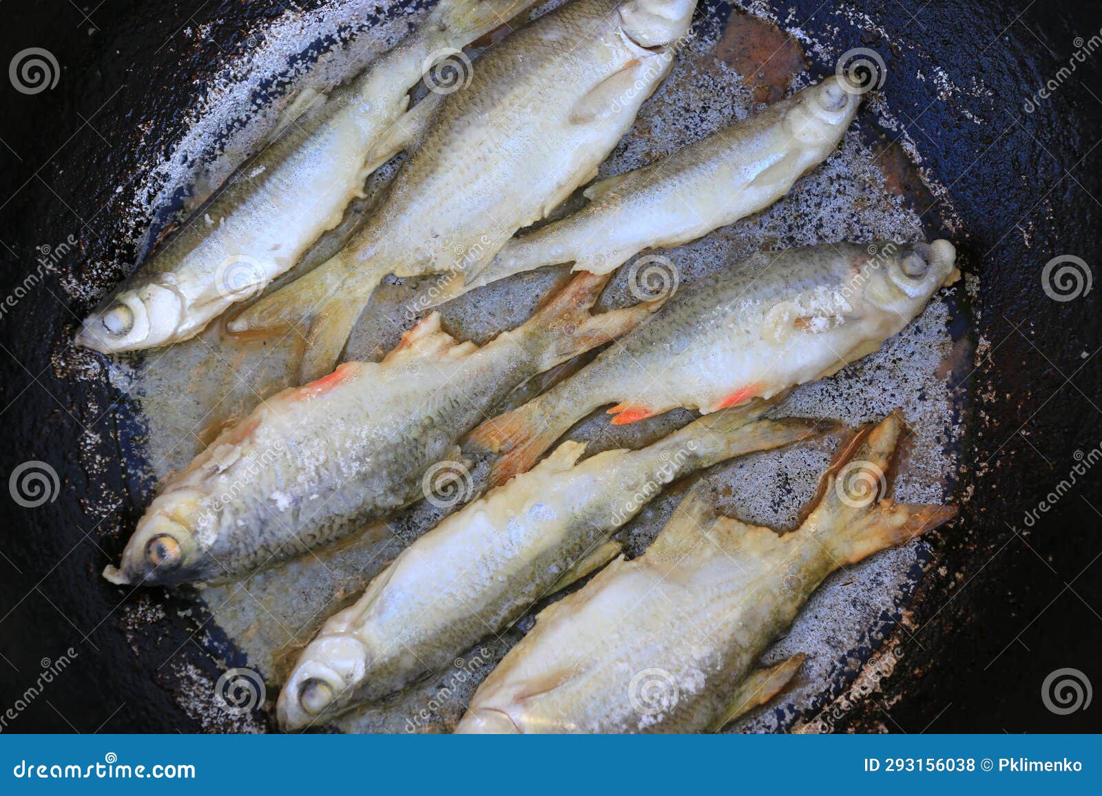 Fried fish in a frying pan stock photo. Image of barbeque - 293156038