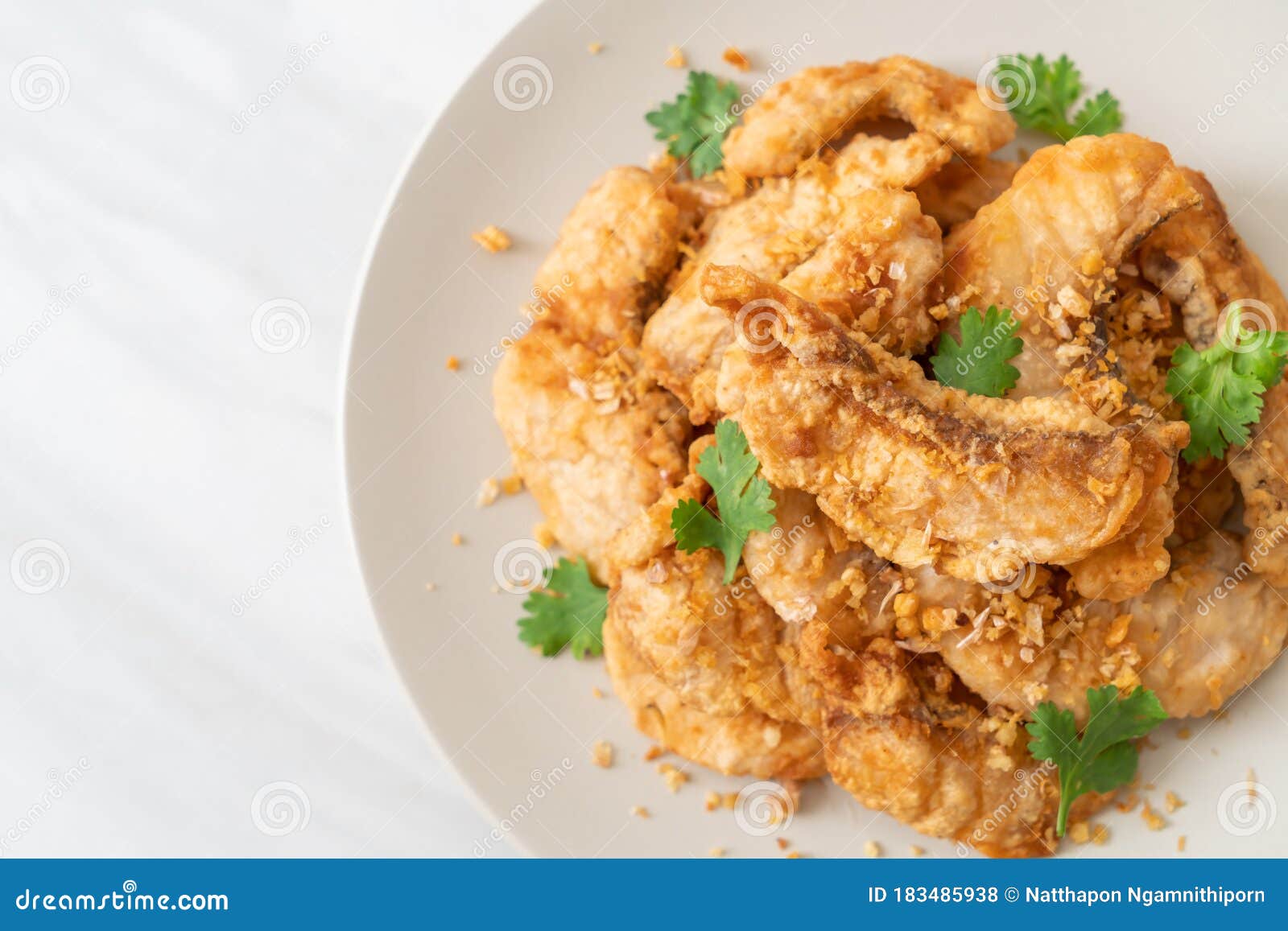 Fried fish with garlic stock photo. Image of fish, prepared - 183485938