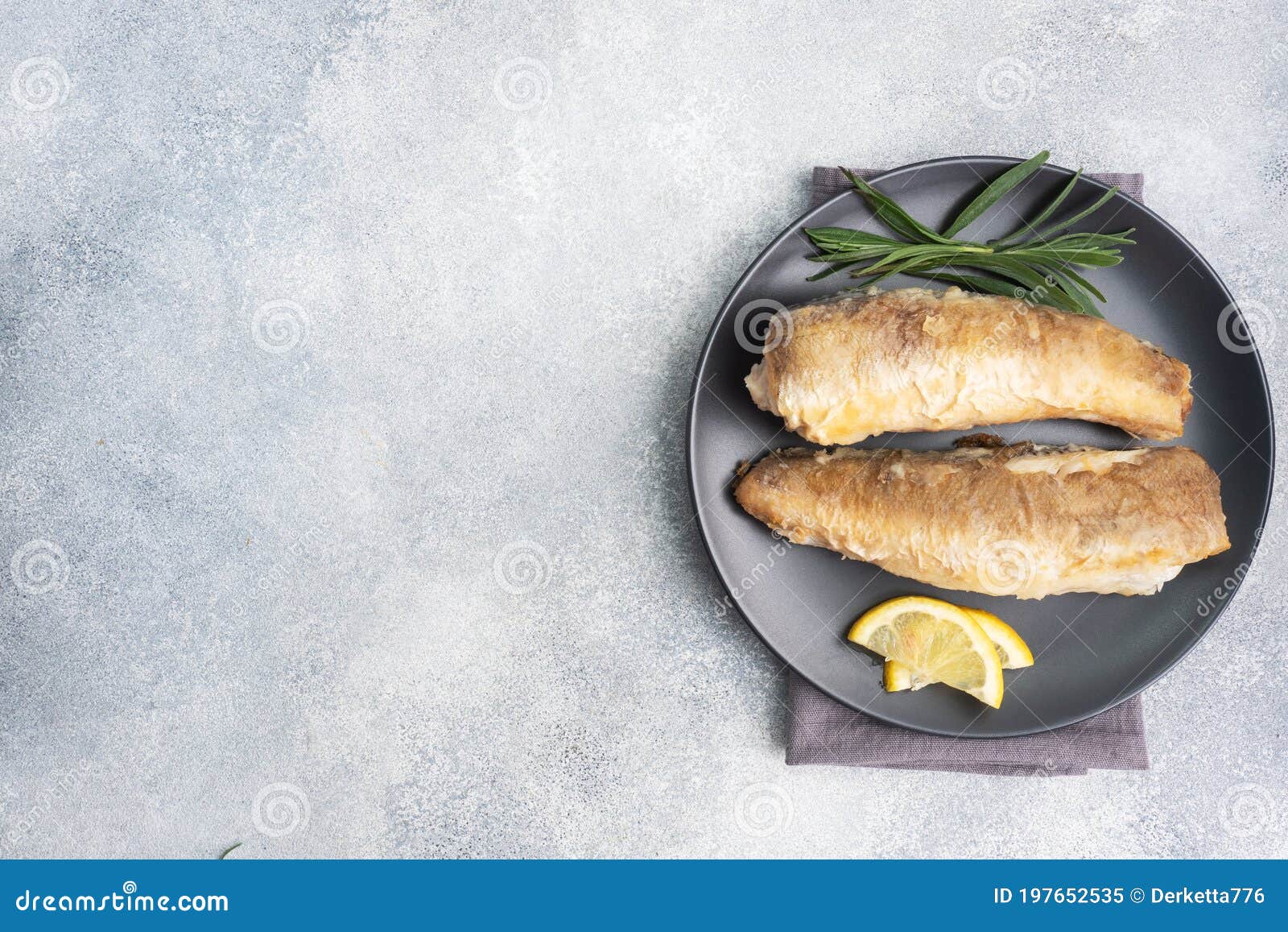 Fried Fish Hake Pollock and Slices of Fresh Lemon. Grey Concrete ...