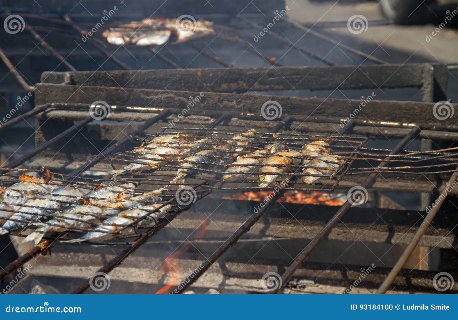 Fried fish on a hot coal. stock photo. Image of closeup - 93184100