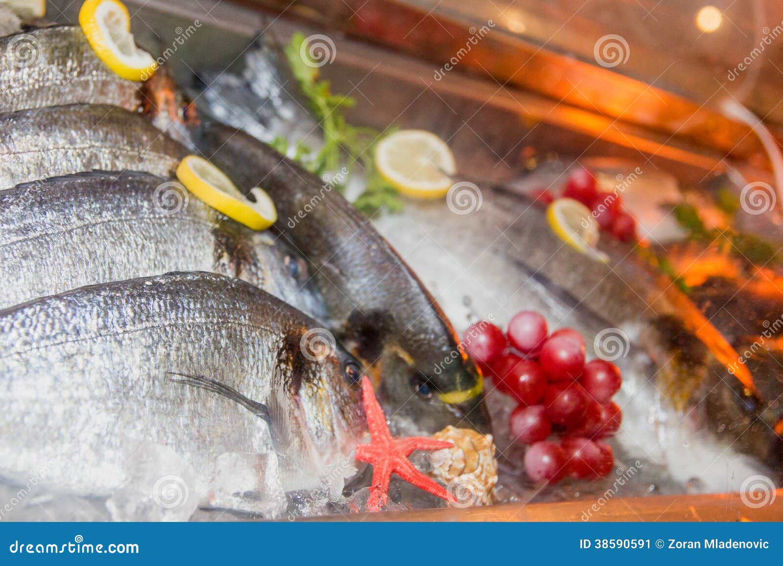 Fried Fish with Lemon and Starfish on the Plate Stock Image - Image of ...