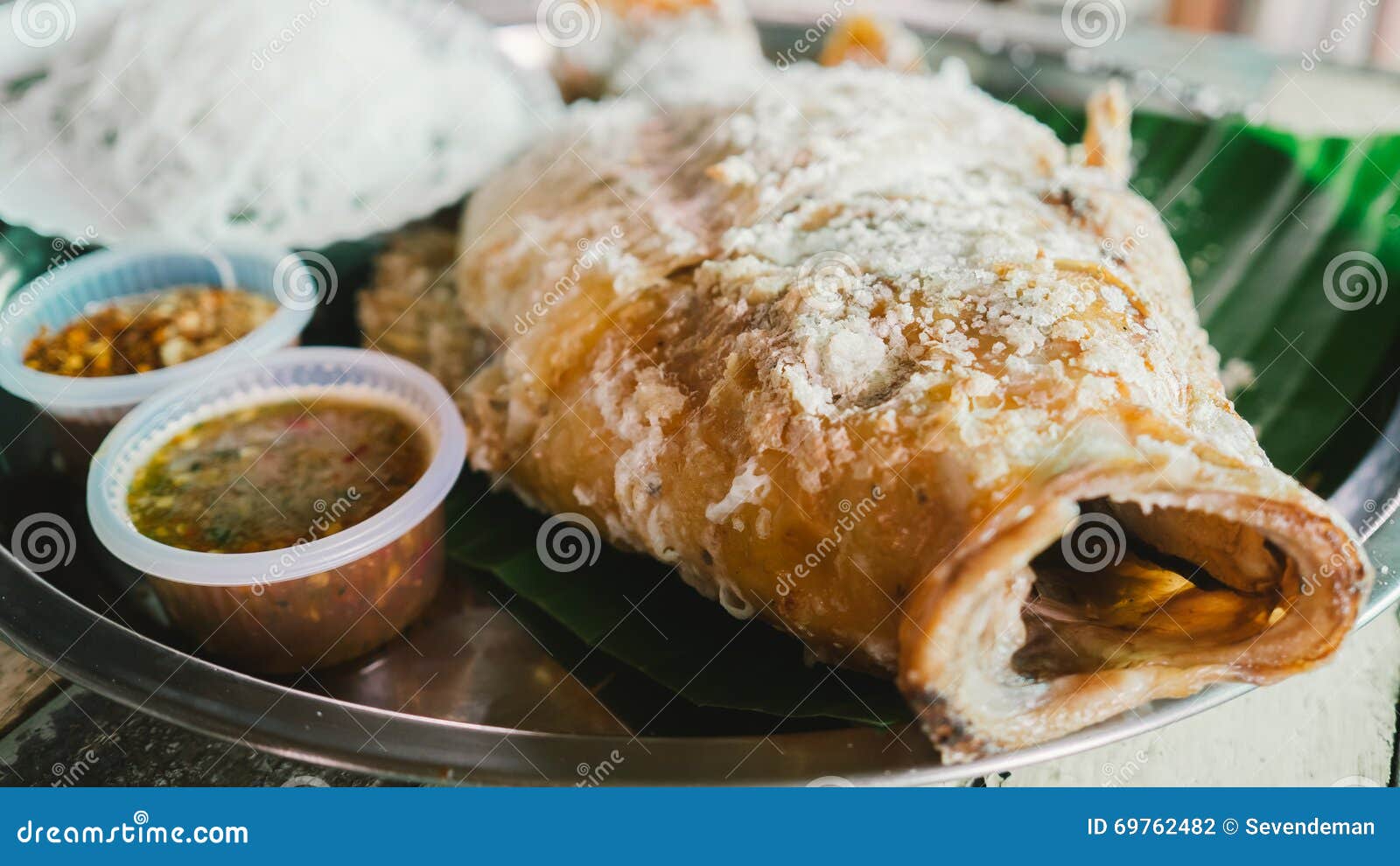 Fried fish with noodles. stock photo. Image of light - 69762482