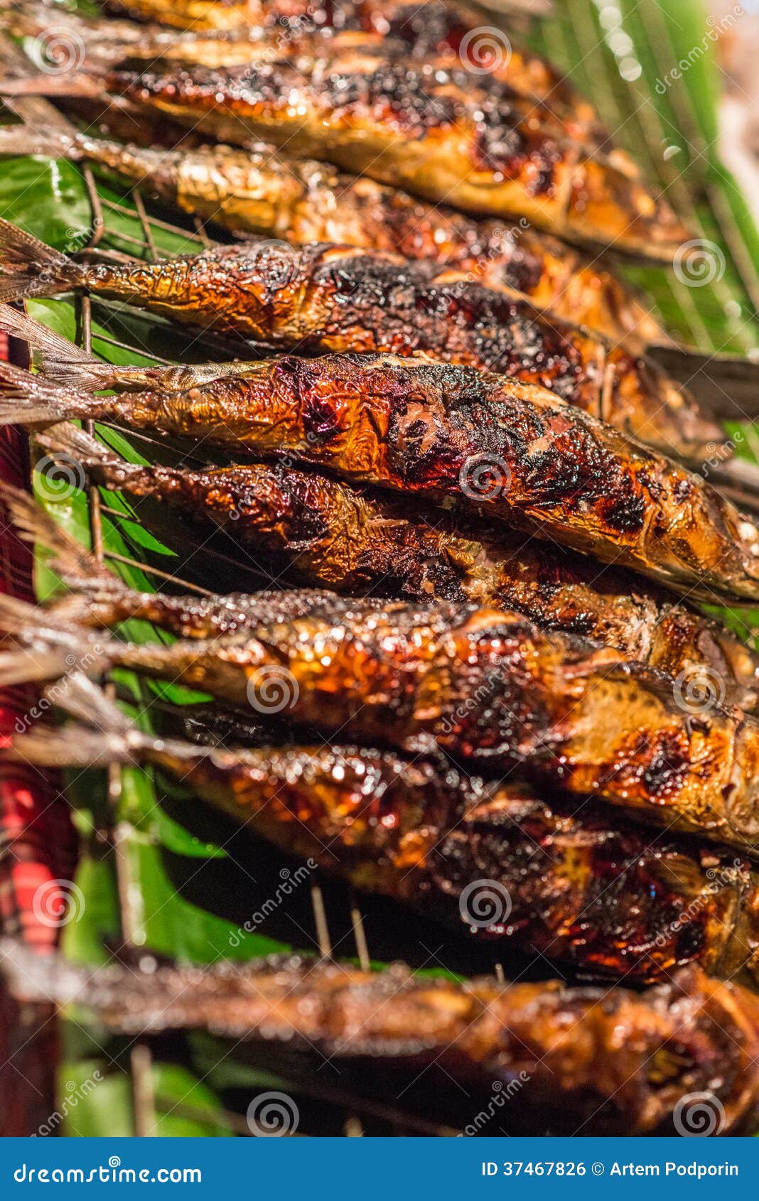 Fried fish on palm leaves stock photo. Image of chinese - 37467826