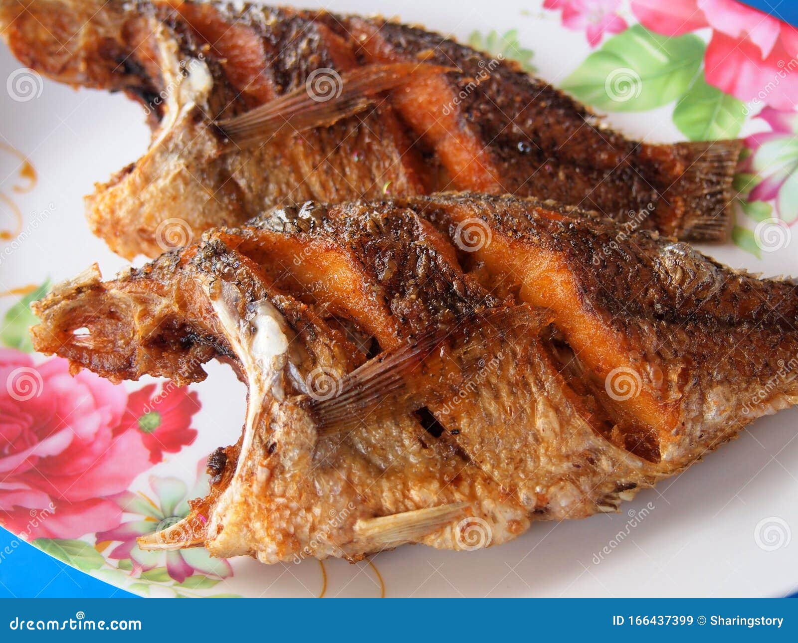 Fried fish on plate stock image. Image of fresh, cook - 166437399