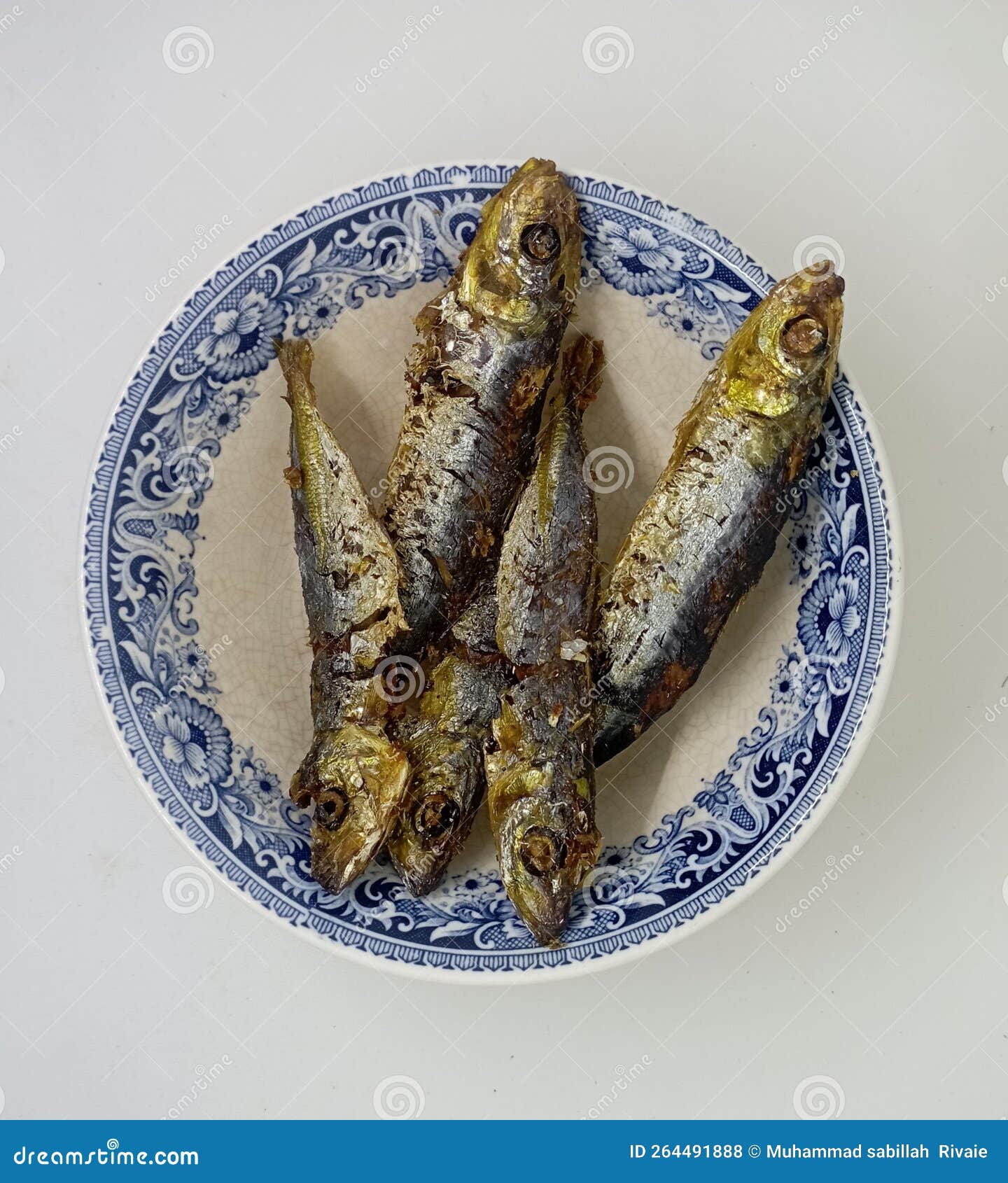 Fried fish on the plate stock photo. Image of plate - 264491888