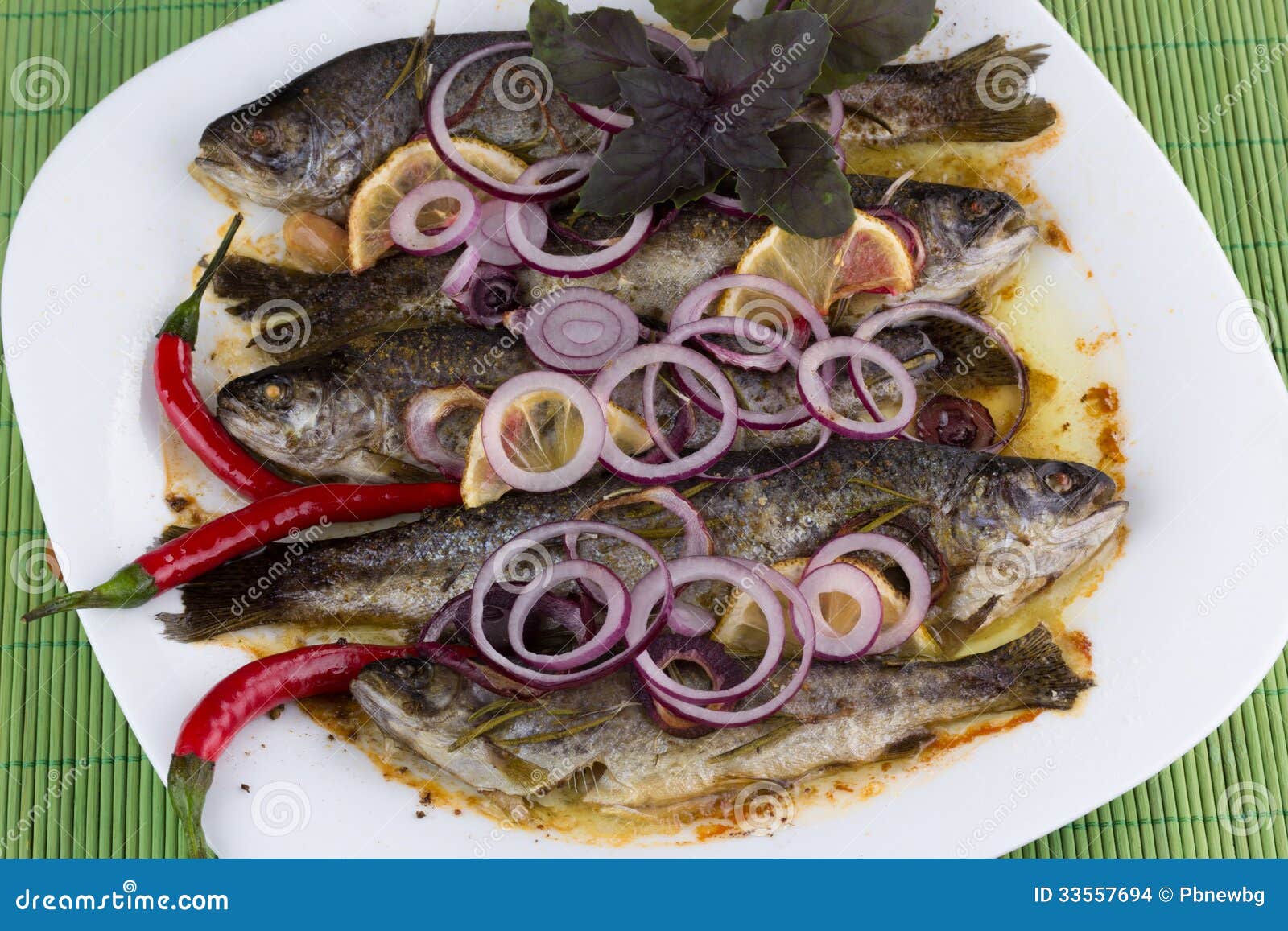 Fried fish on a platter stock photo. Image of onions - 33557694