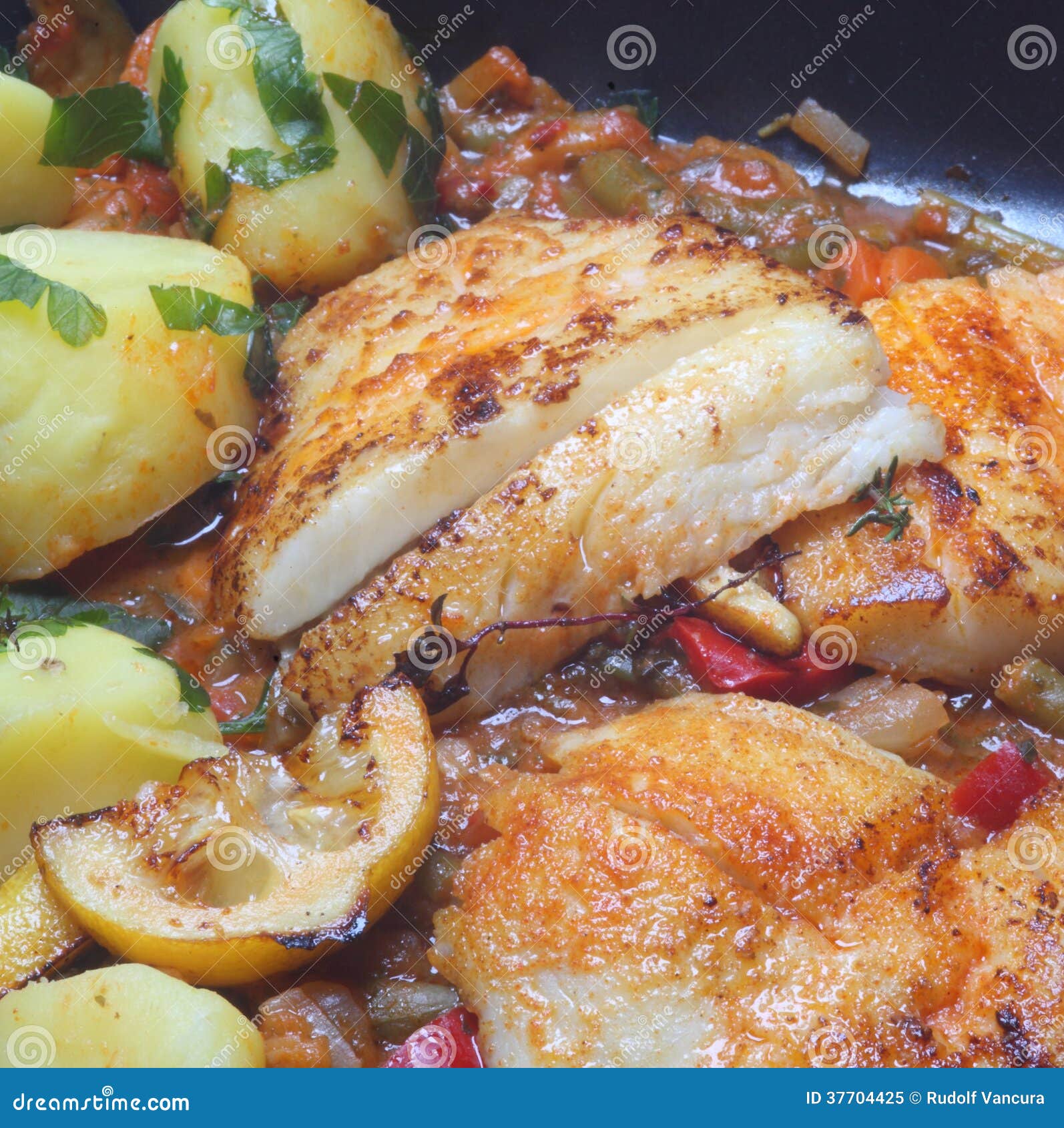 Fried fish and potatoes stock image. Image of herbs, spices - 37704425