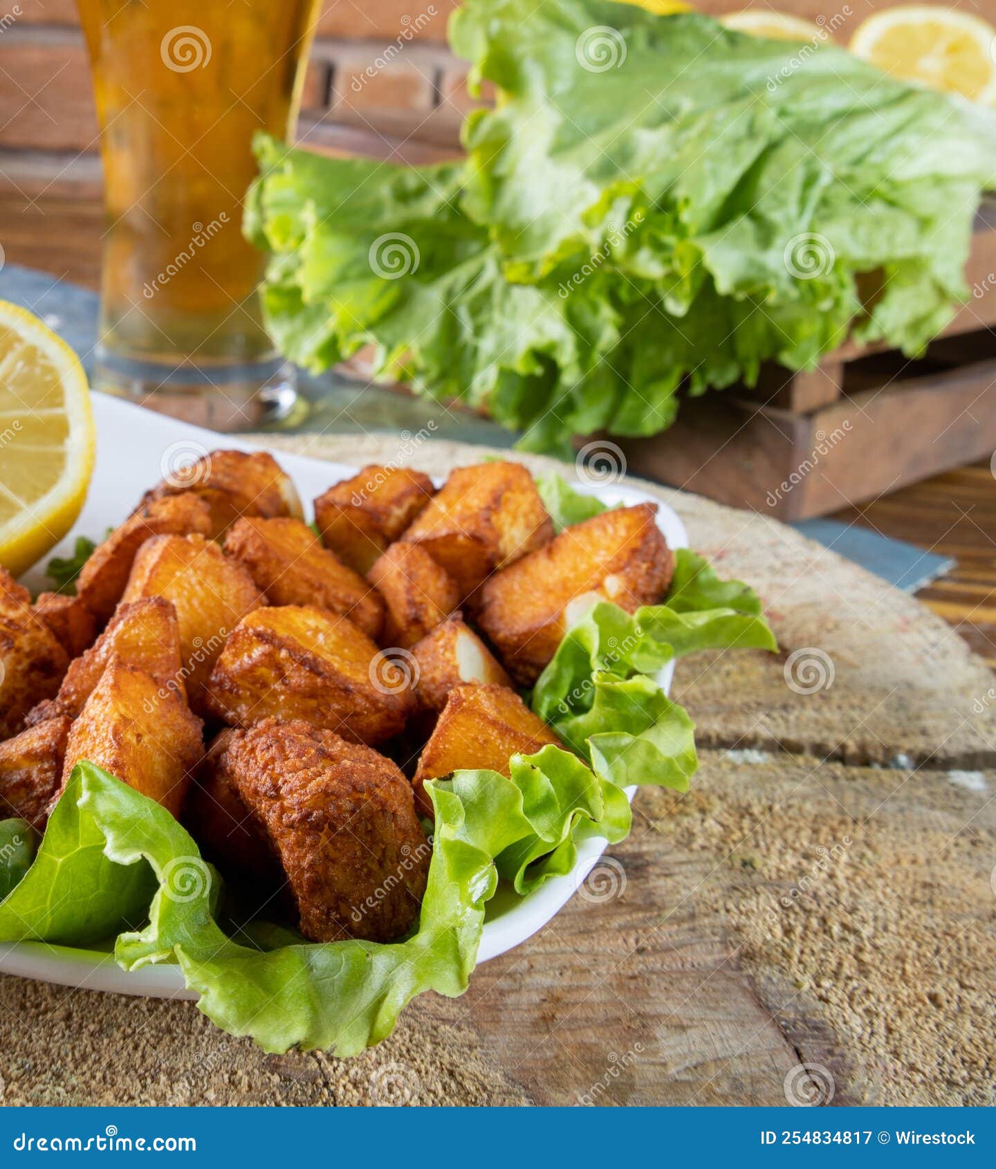 Fried Fish Served in a Plate with Lettuce, Vertical Stock Image - Image ...