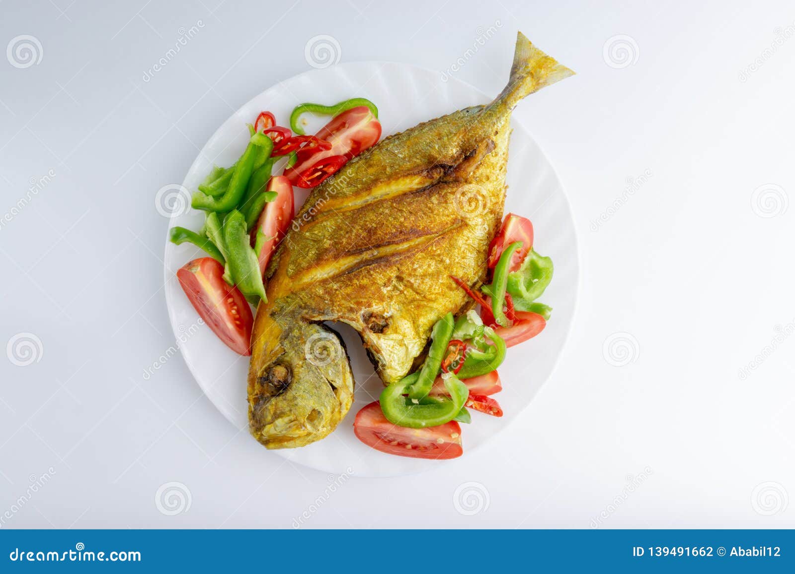 Fried Fish on White Background with Selective Focus Stock Photo - Image ...