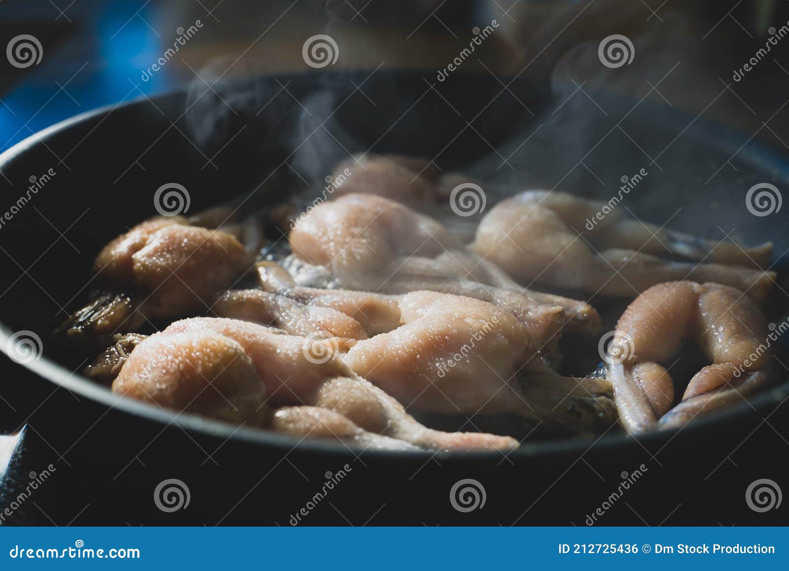 Fried frog legs on pan stock photo. Image of cookery - 212725436