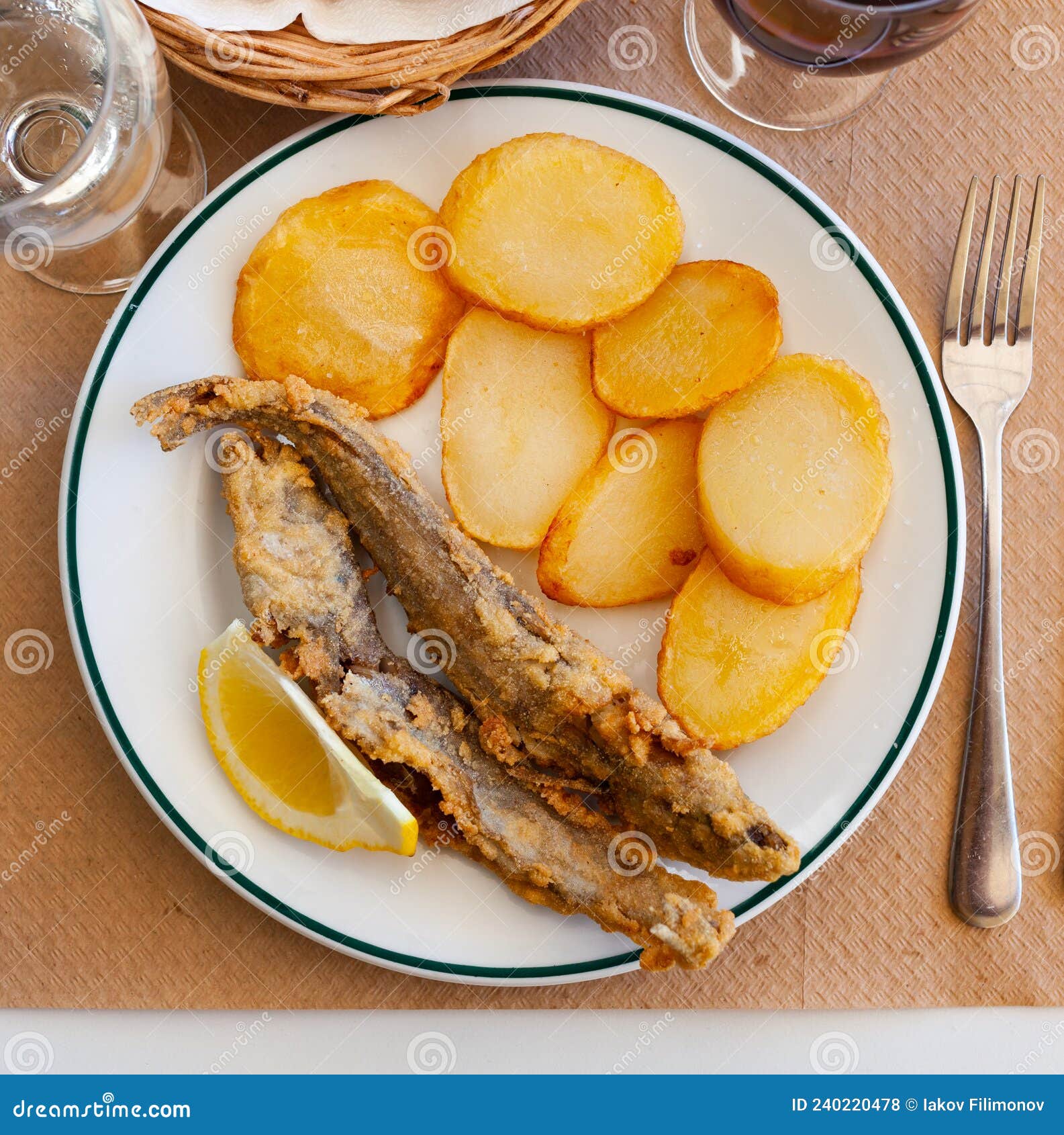 Fried Hake Served with Boiled Potatoes and Lemon Stock Photo - Image of ...