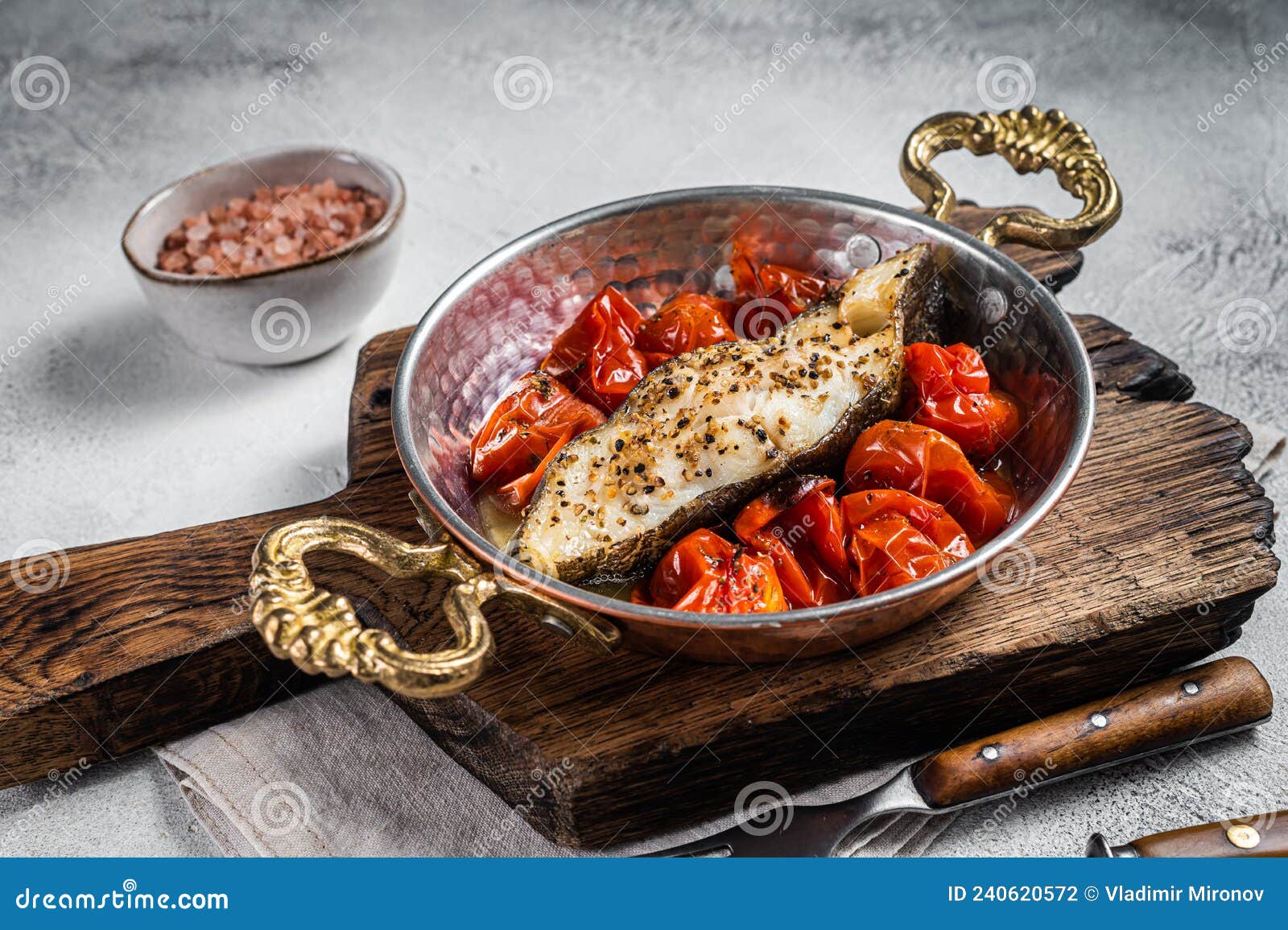 Fried Halibut Fish Steaks with Tomato in Skillet. White Background ...