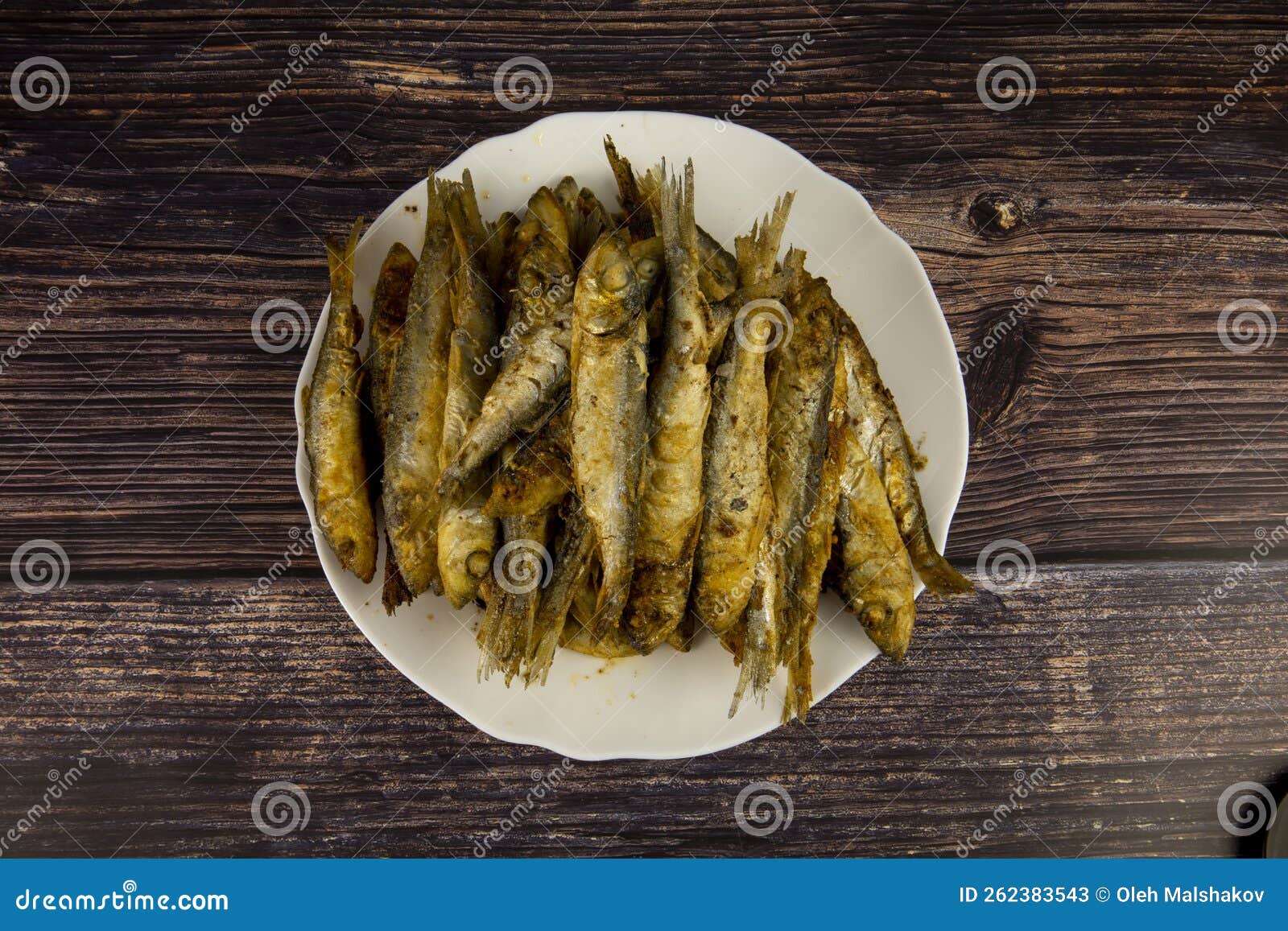 Fried herring on a plate stock image. Image of nutritious - 262383543