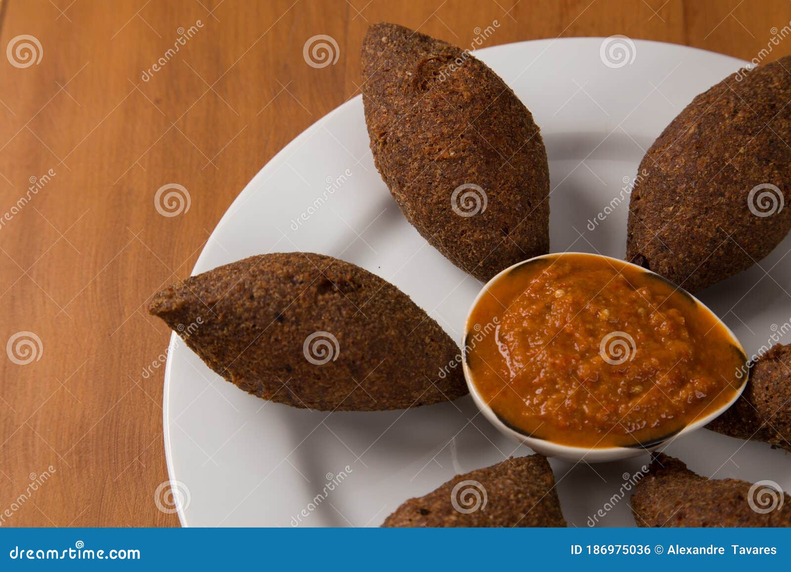 Fried Kibbeh Served with Pepper Sauce, on a White Plate Stock Photo ...