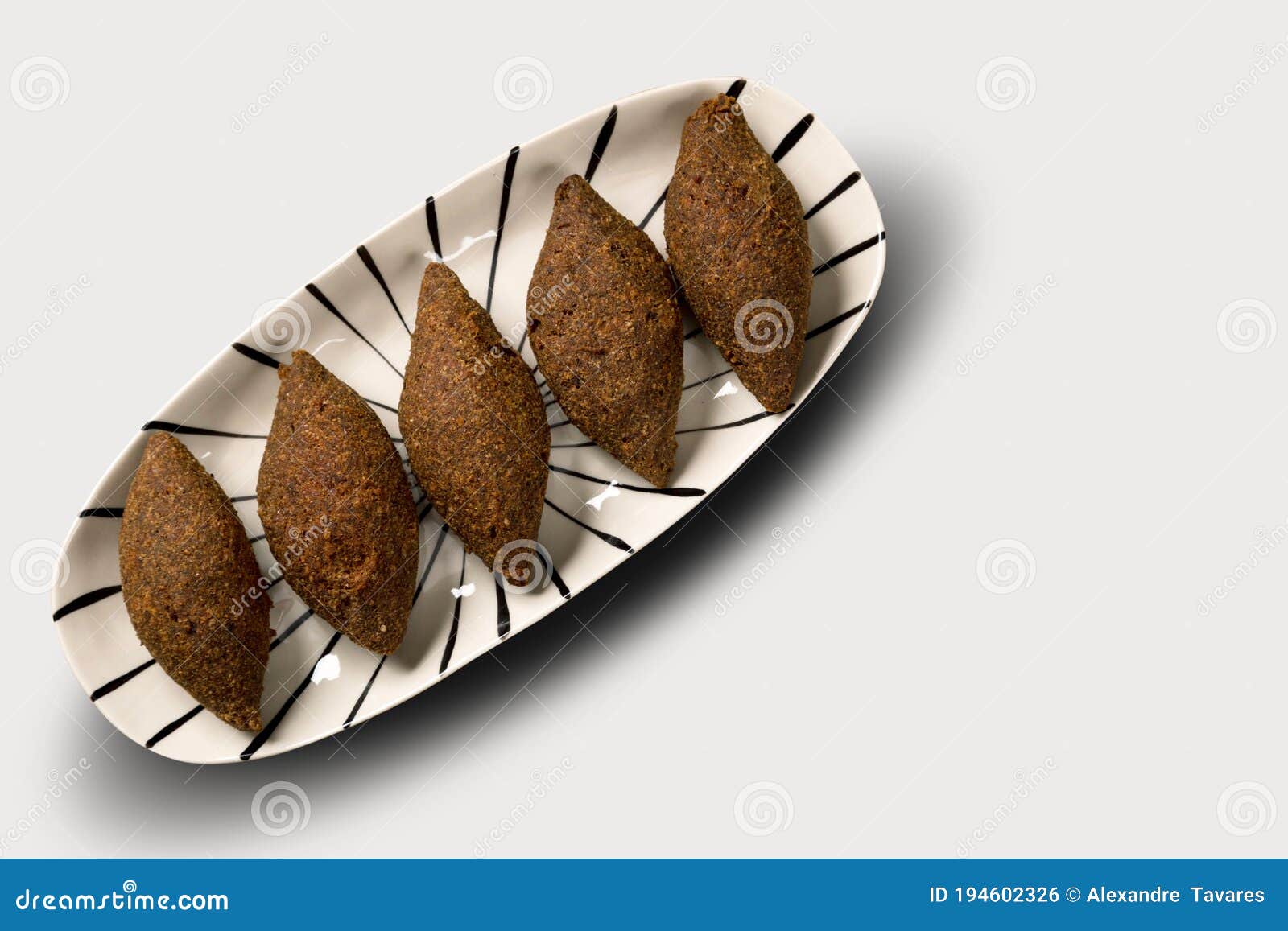 Fried Kibbeh, Served on a Plate, on Wooden Background Stock Photo ...