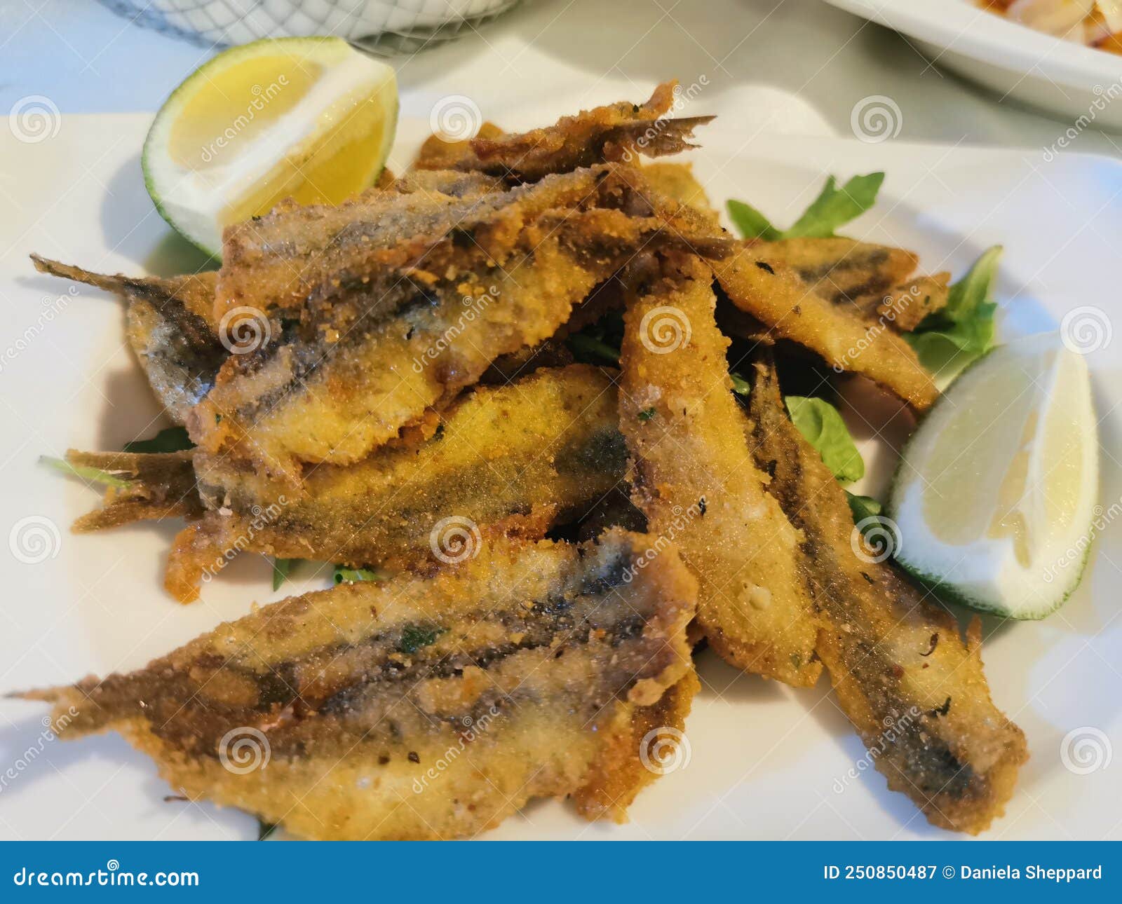 Fried Lightly Battered Fresh Fish with Lemon Stock Image - Image of ...